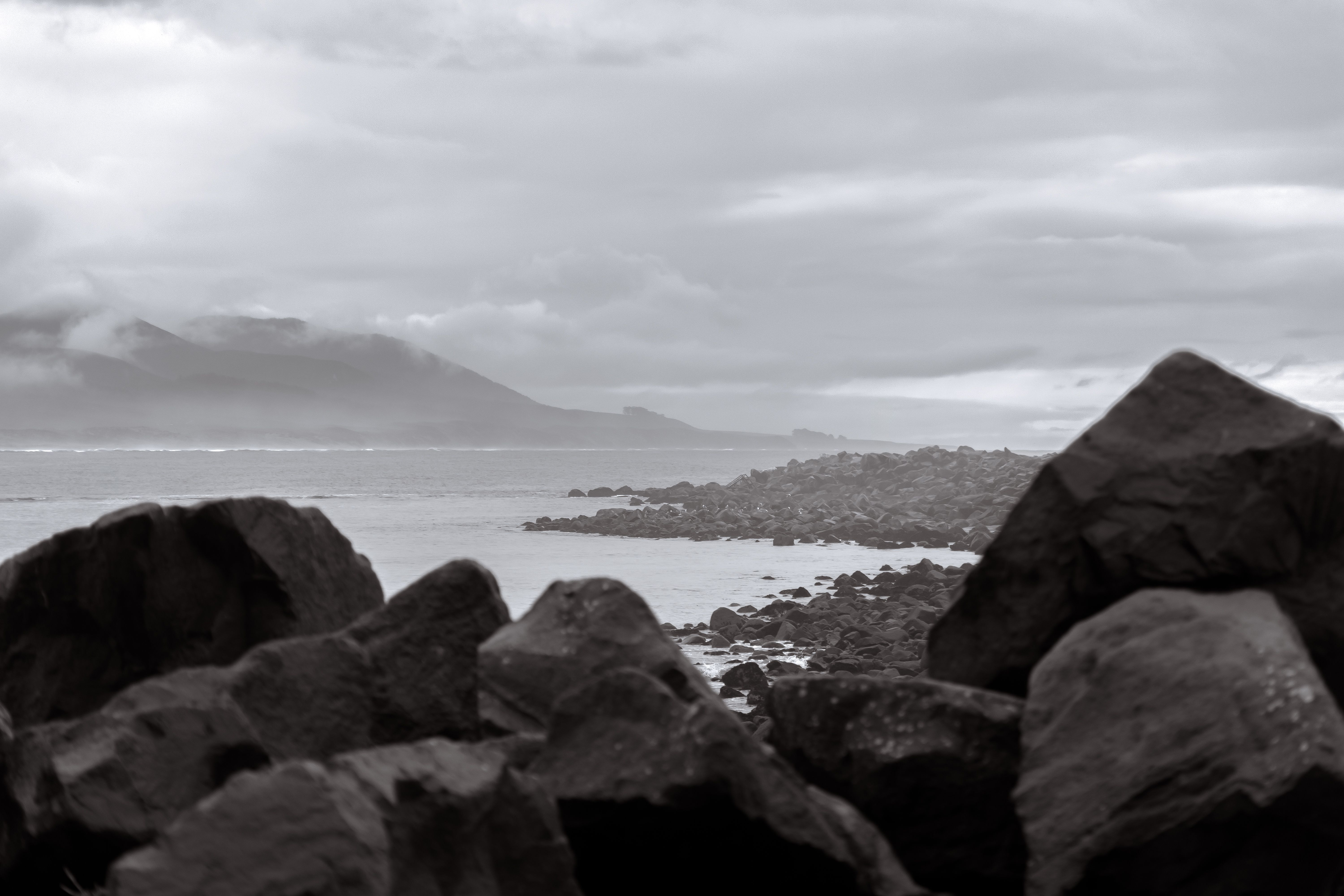 Dramatic Coastal Scene with Stormy Sky · Free Stock Photo