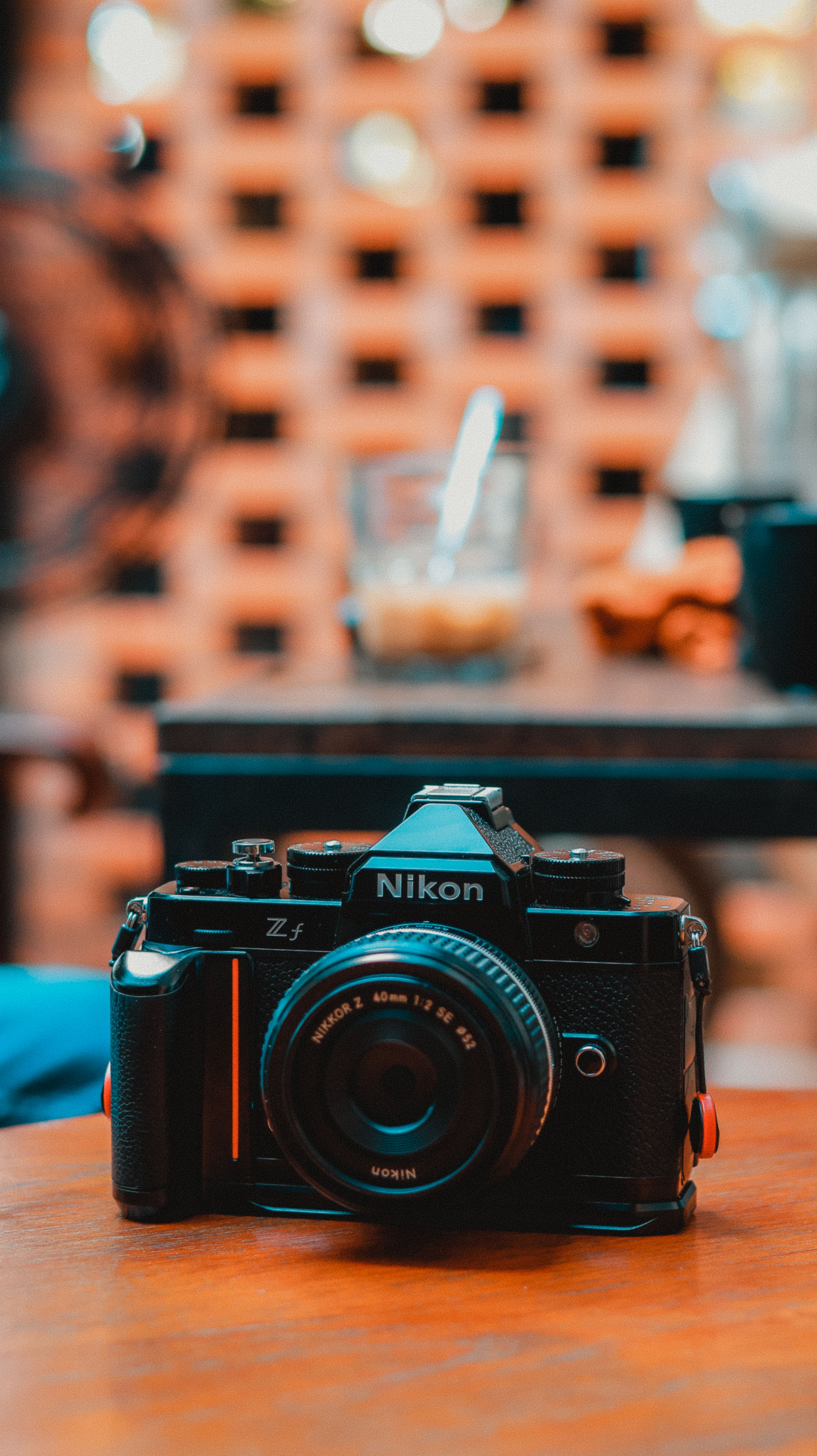 Vintage Camera on Wooden Table in Cafe Setting · Free Stock Photo