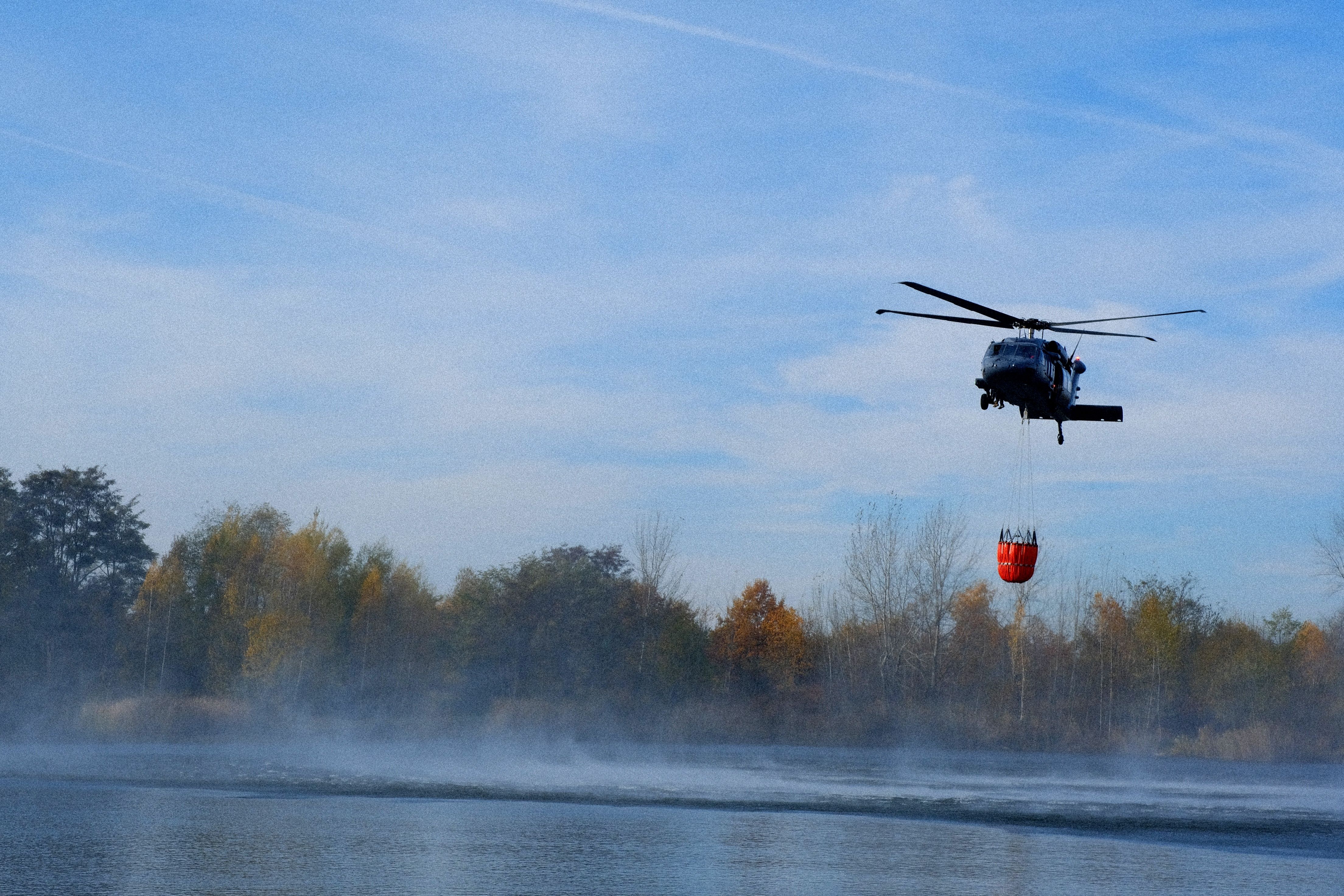 Helicopter Collects Water for Firefighting · Free Stock Photo