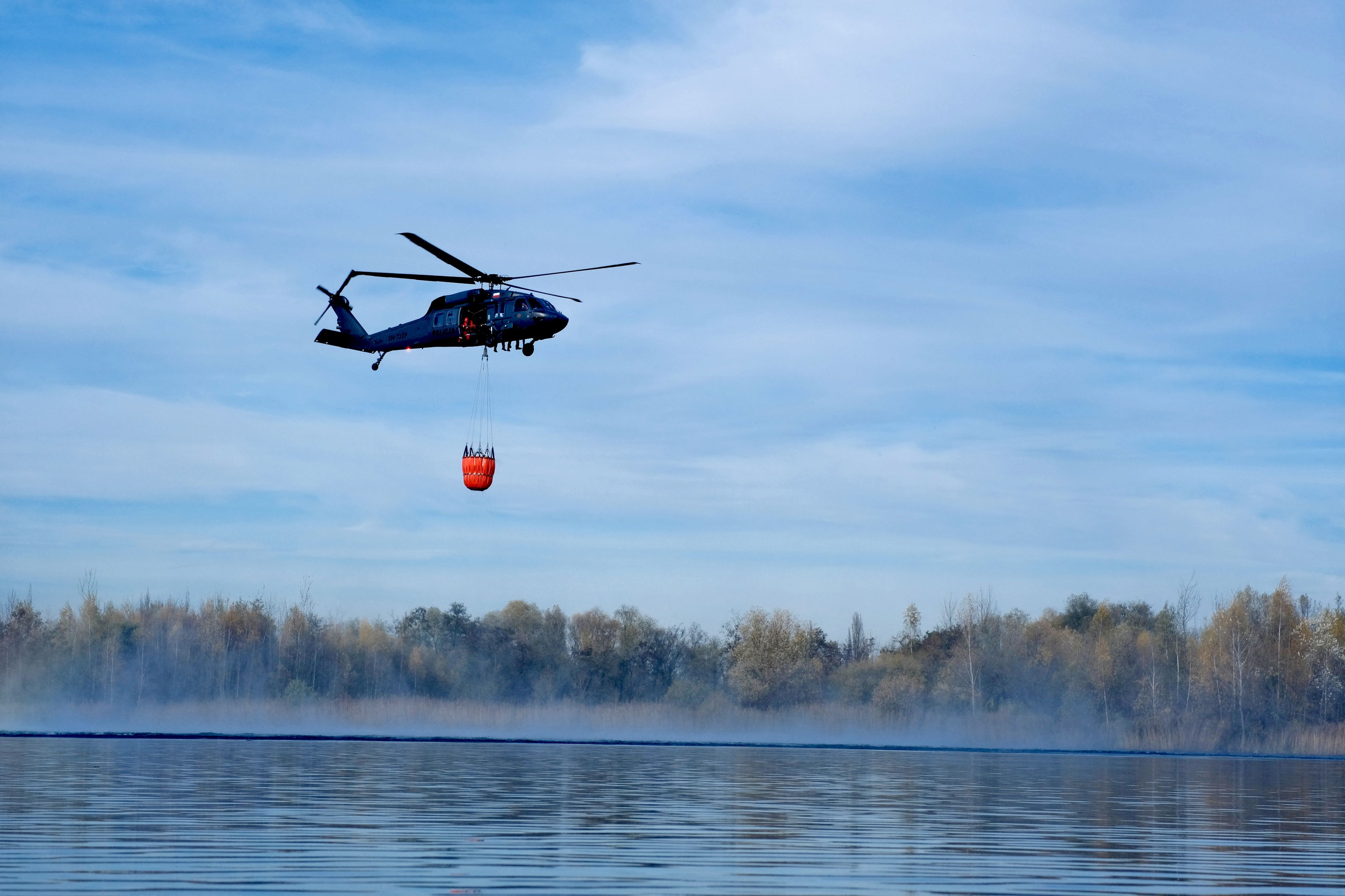 Helicopter Collecting Water for Firefighting · Free Stock Photo