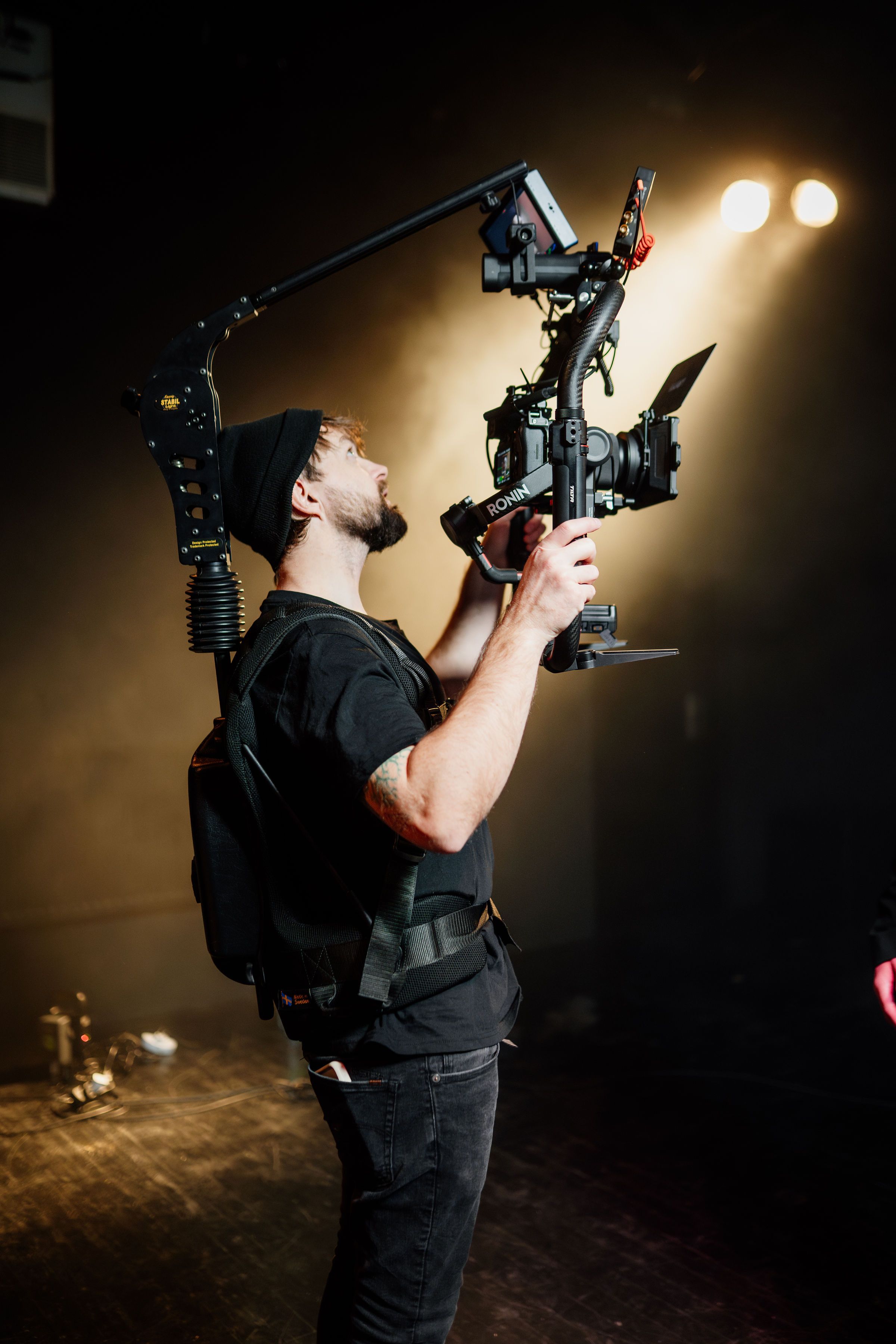 Cinematic Filmmaker Using Stabilized Camera Rig · Free Stock Photo