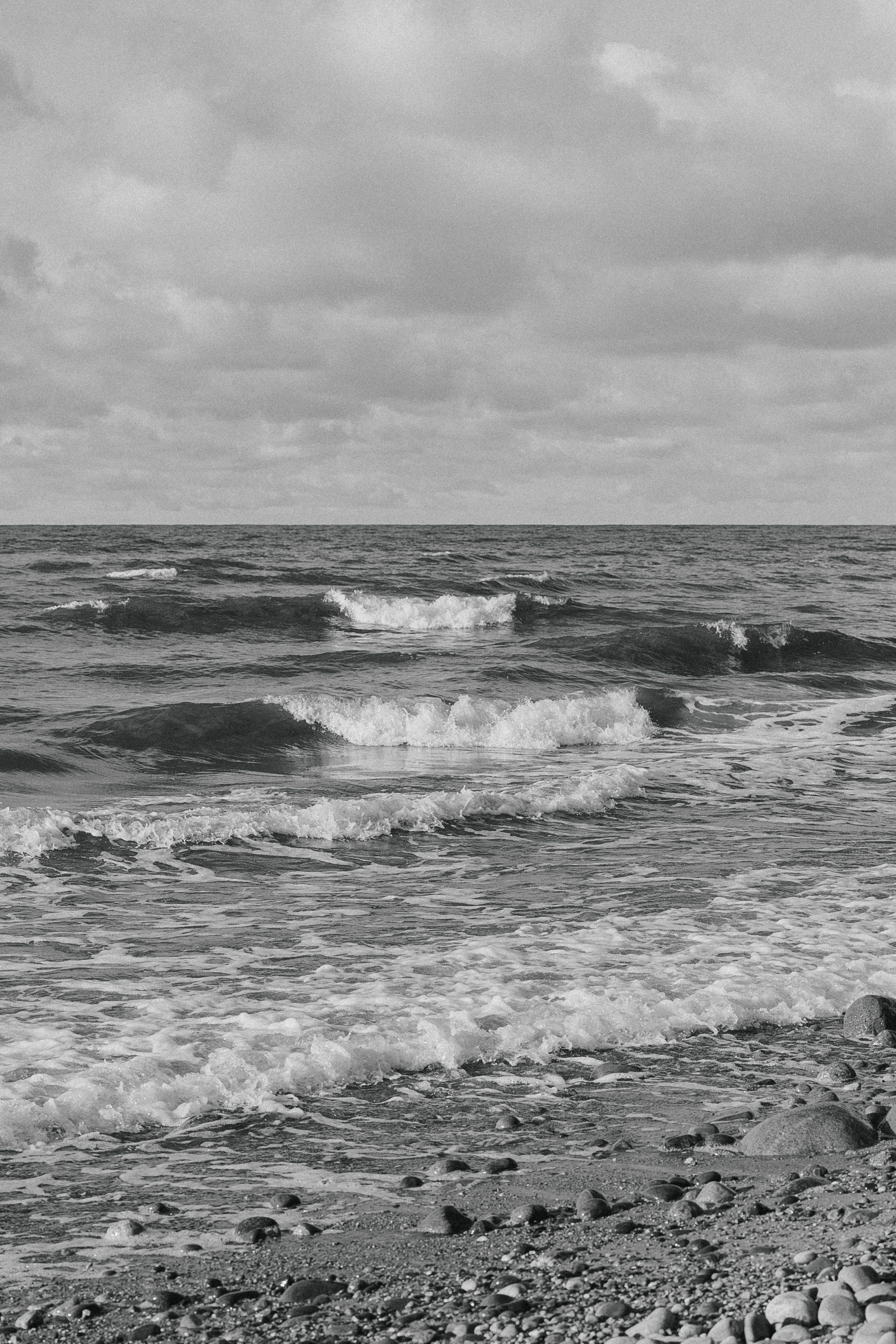 Monochrome Ocean Waves Hitting Rocky Shore · Free Stock Photo