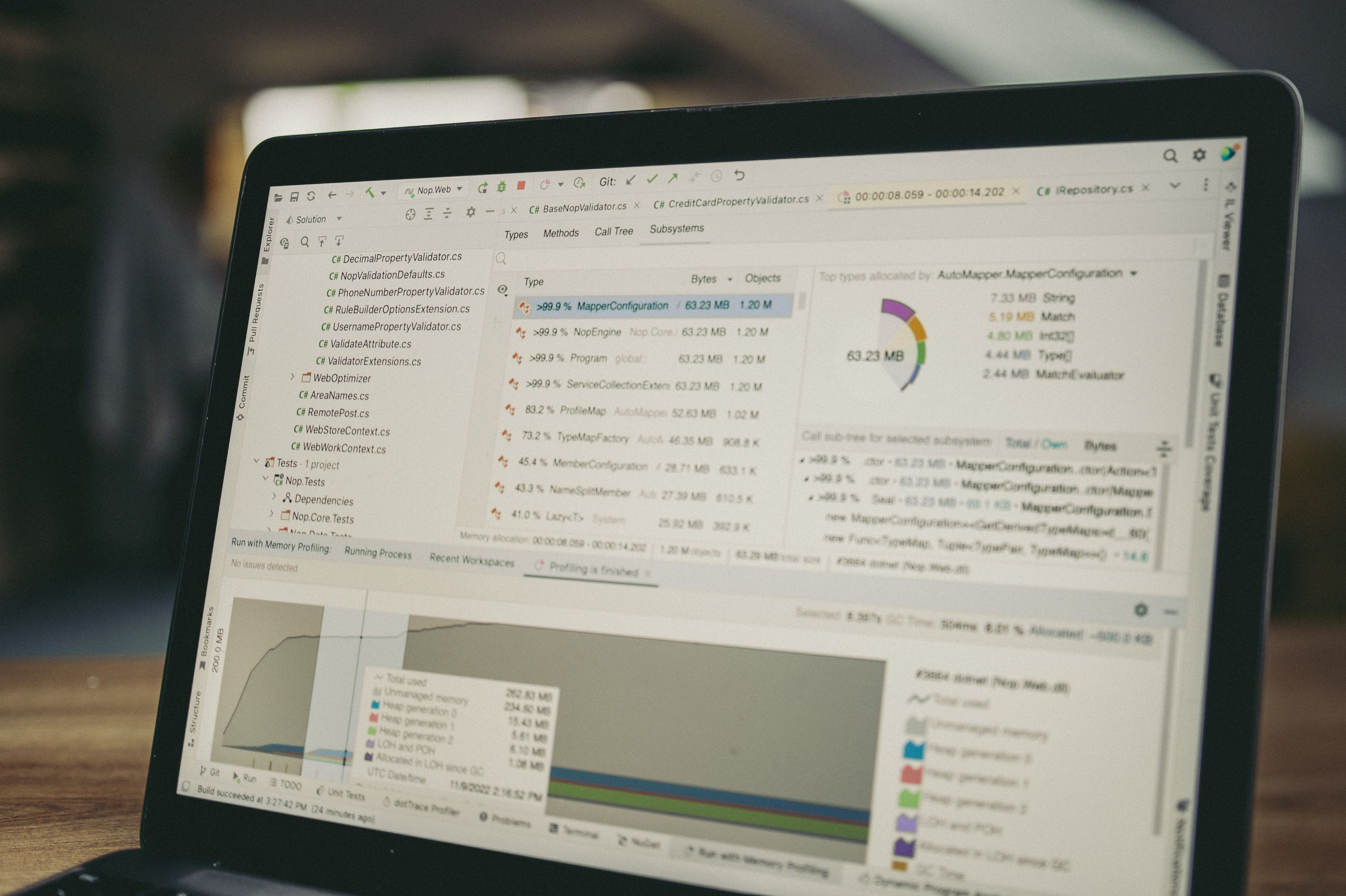 Laptop displaying coding and data analysis interface · Free Stock Photo