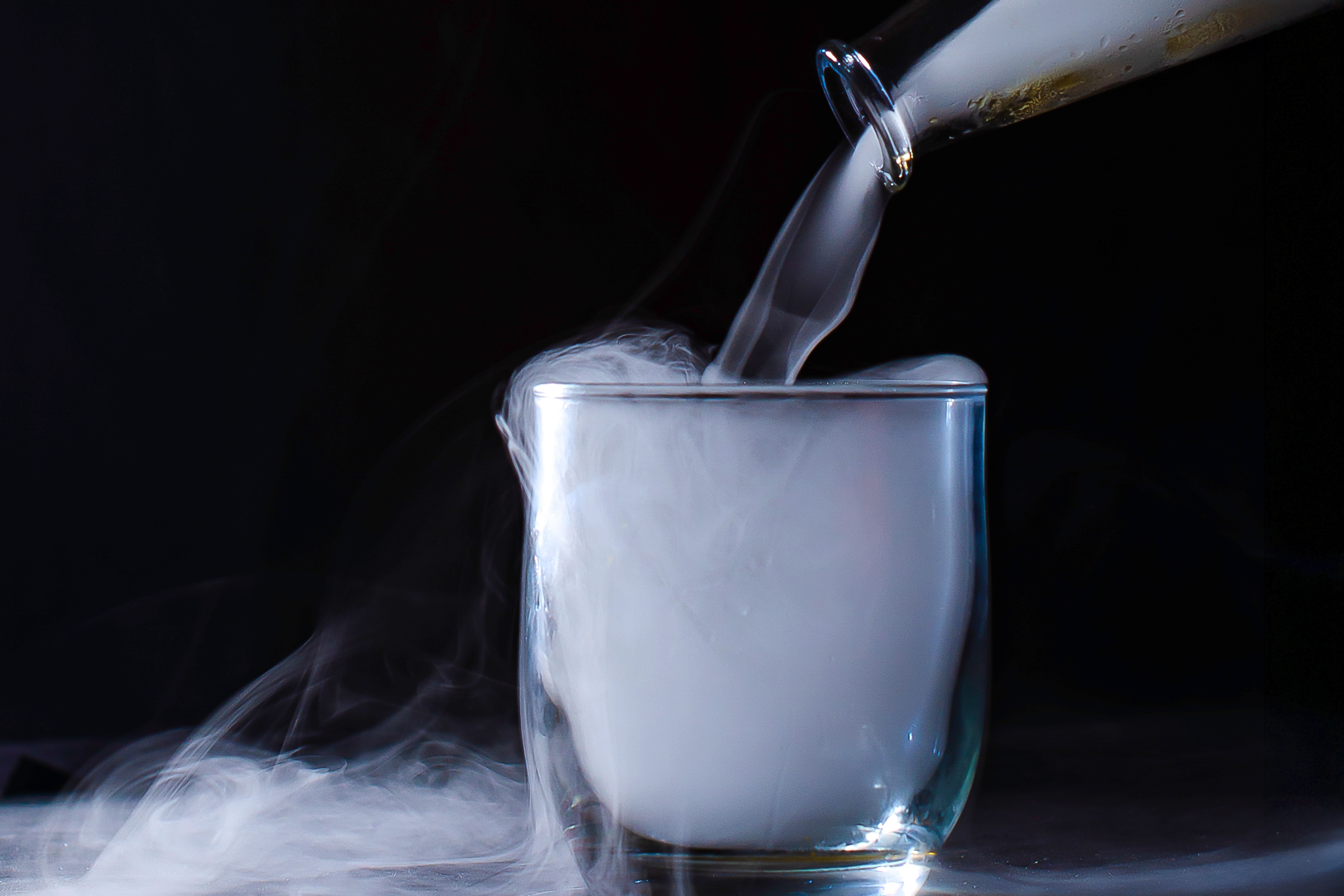 Pouring Mysterious Misty Drink into Glass · Free Stock Photo