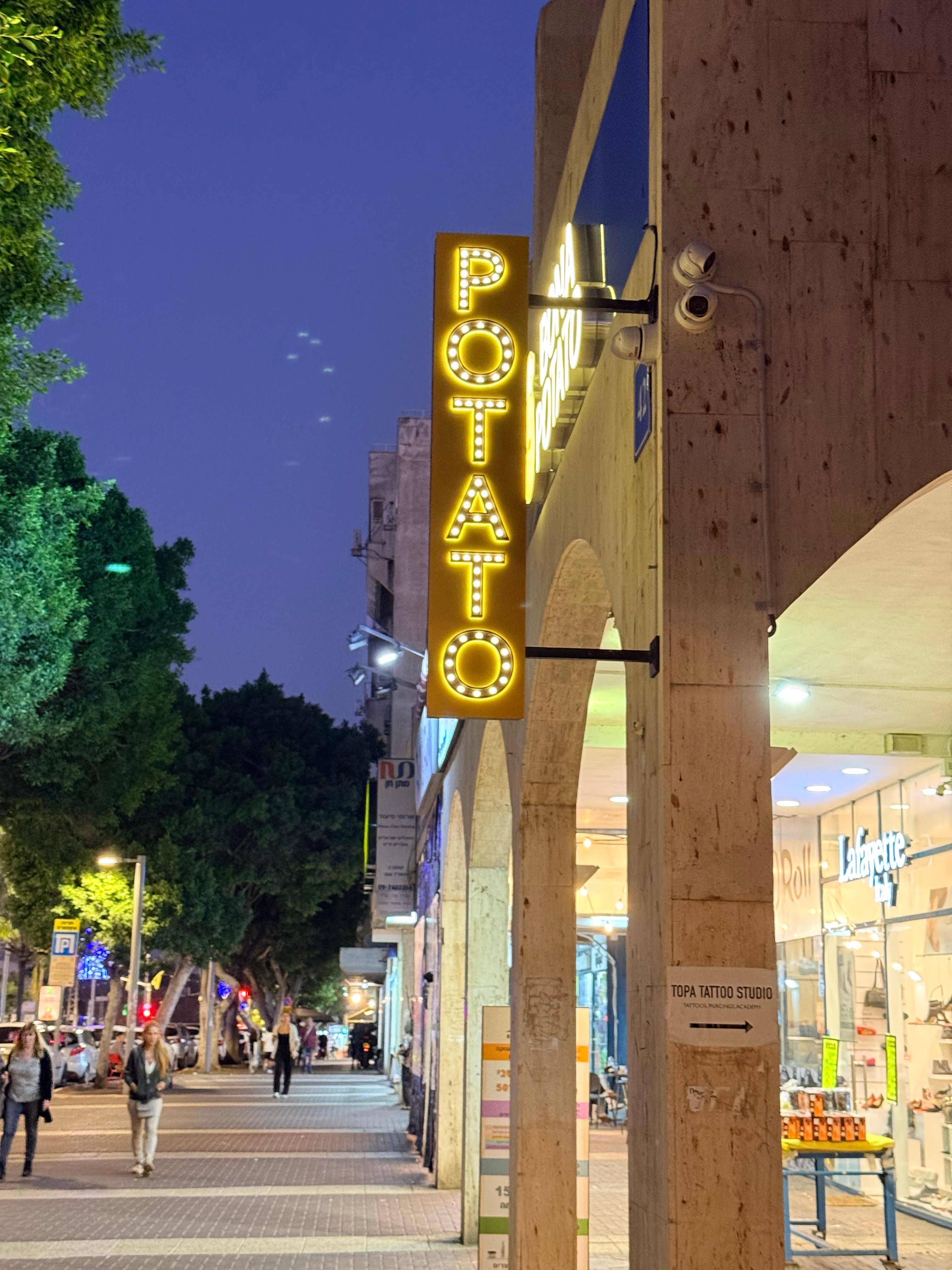 Street Scene in Kefar Sava with Illuminated Signs · Free Stock Photo