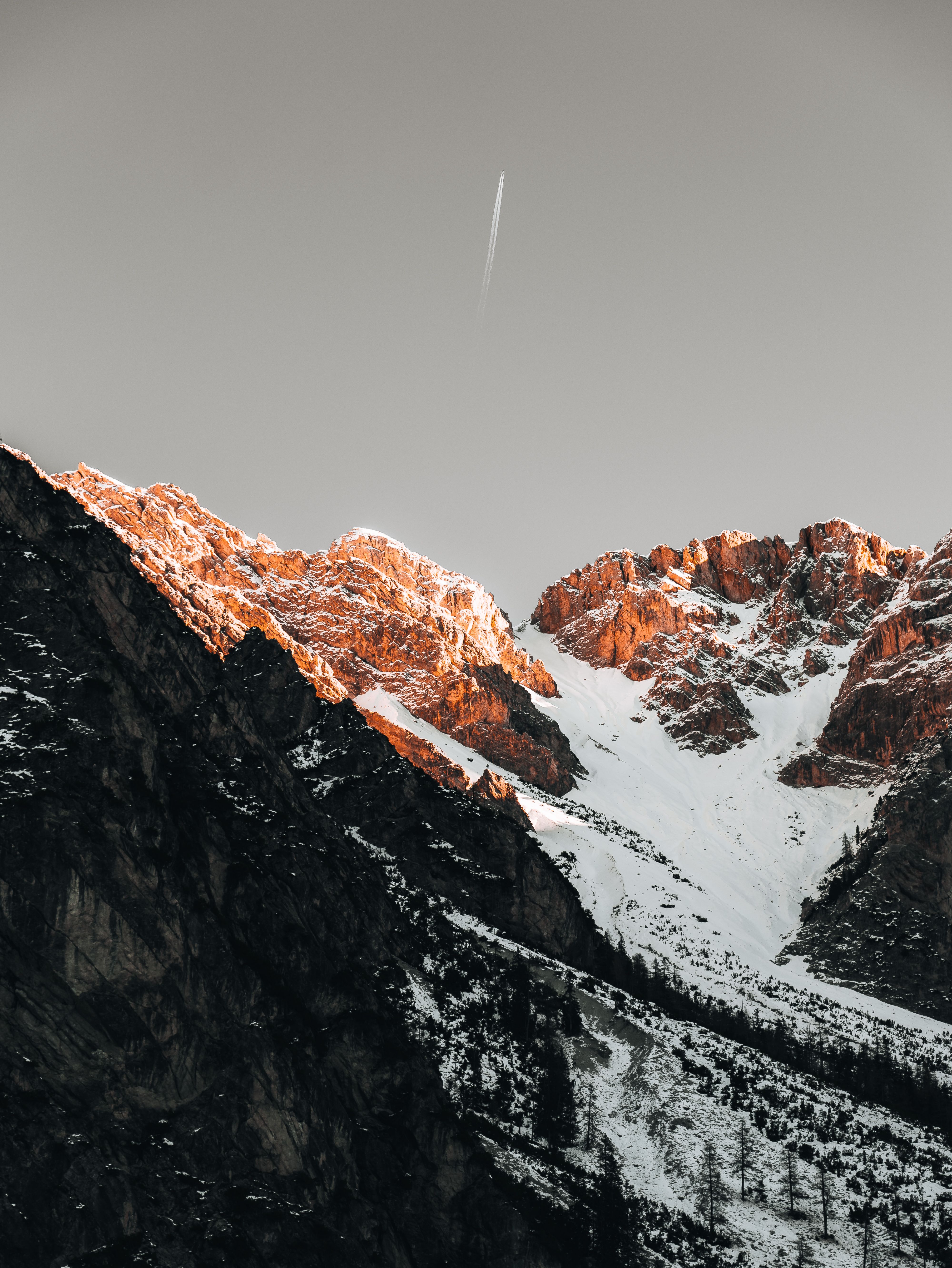 Dramatic Snow-Capped Mountain Peaks at Sunset · Free Stock Photo