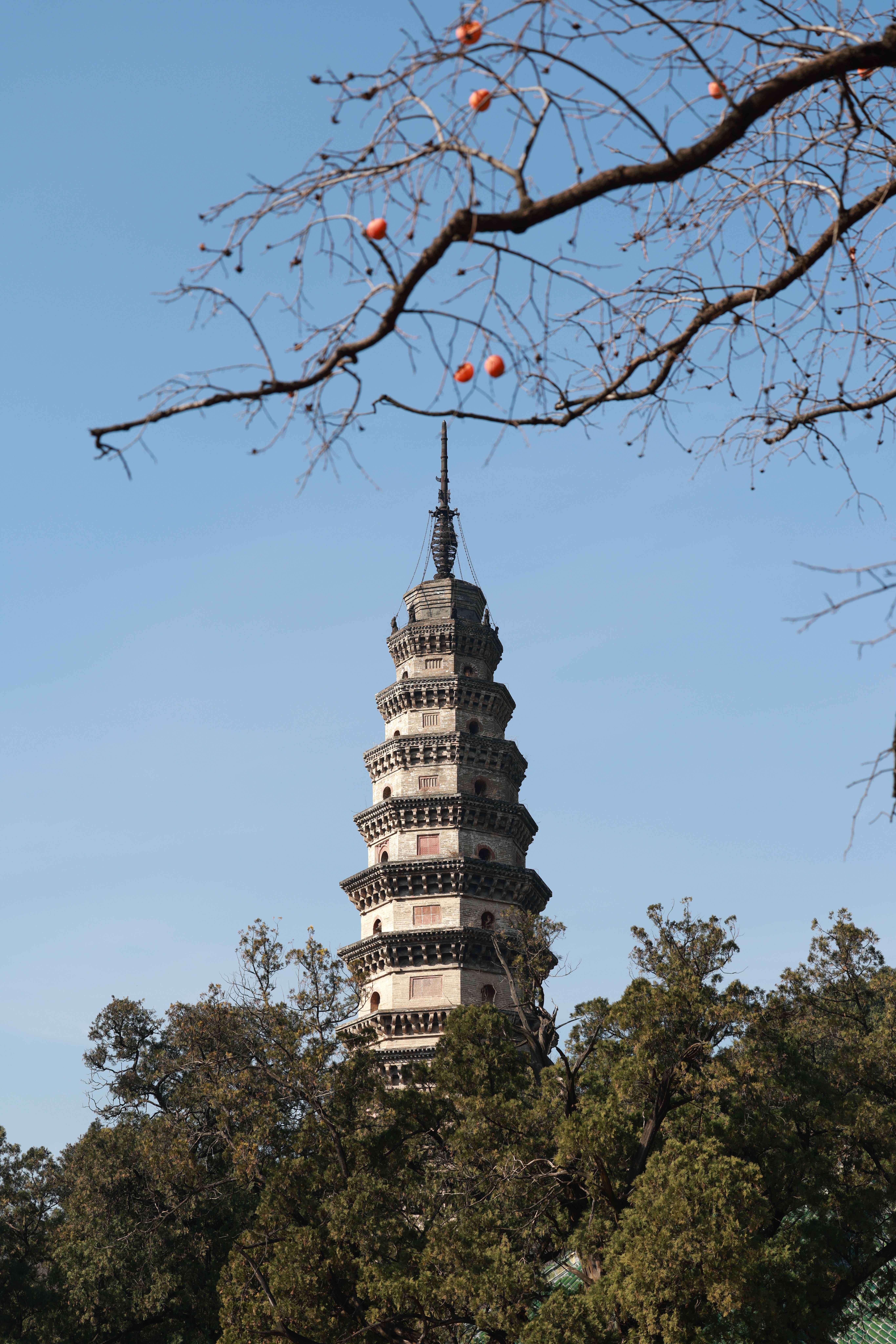 Ancient Pagoda Amidst Foliage Under Blue Sky · Free Stock Photo