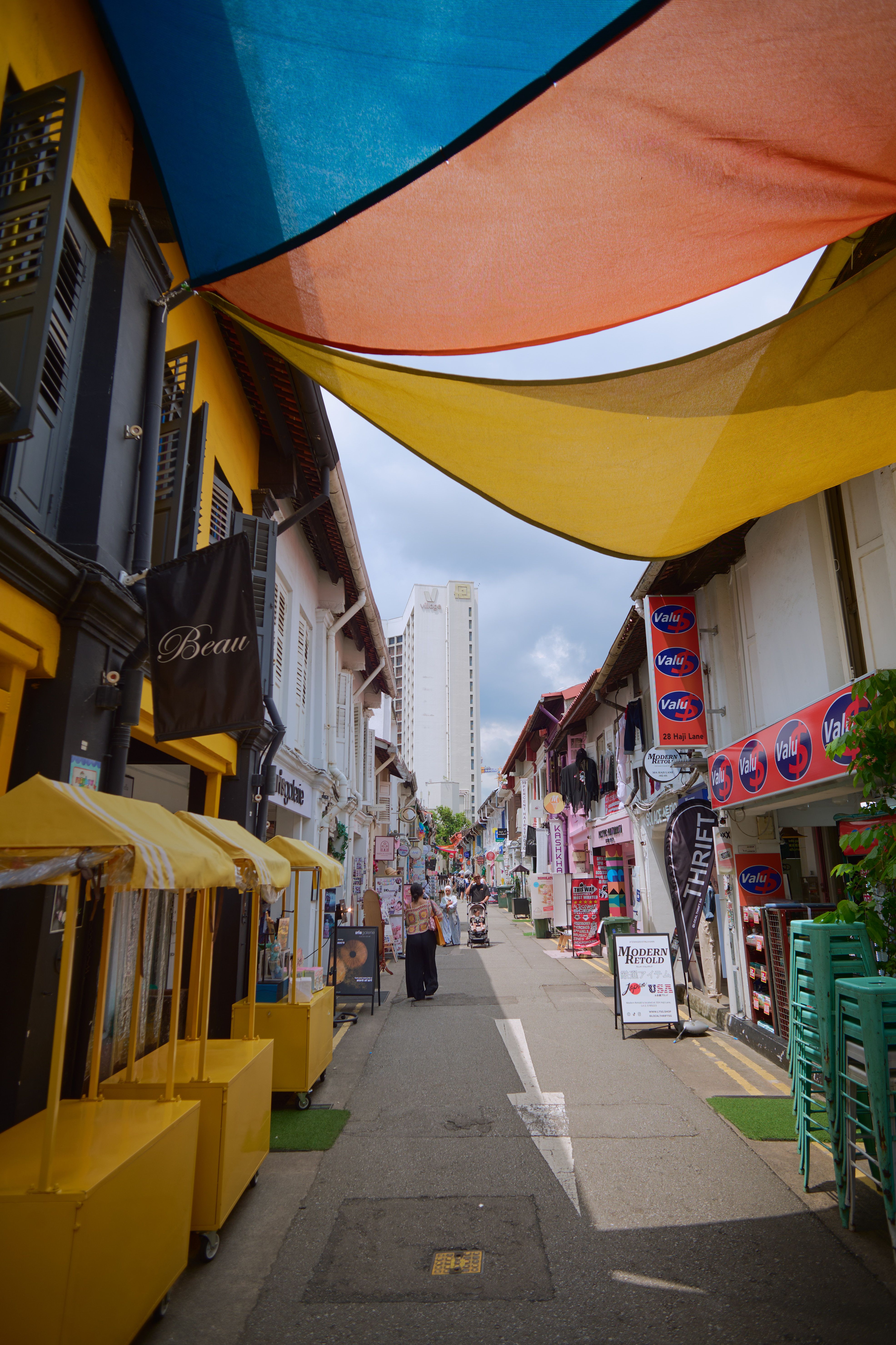 Vibrant Street Scene with Colorful Canopies · Free Stock Photo