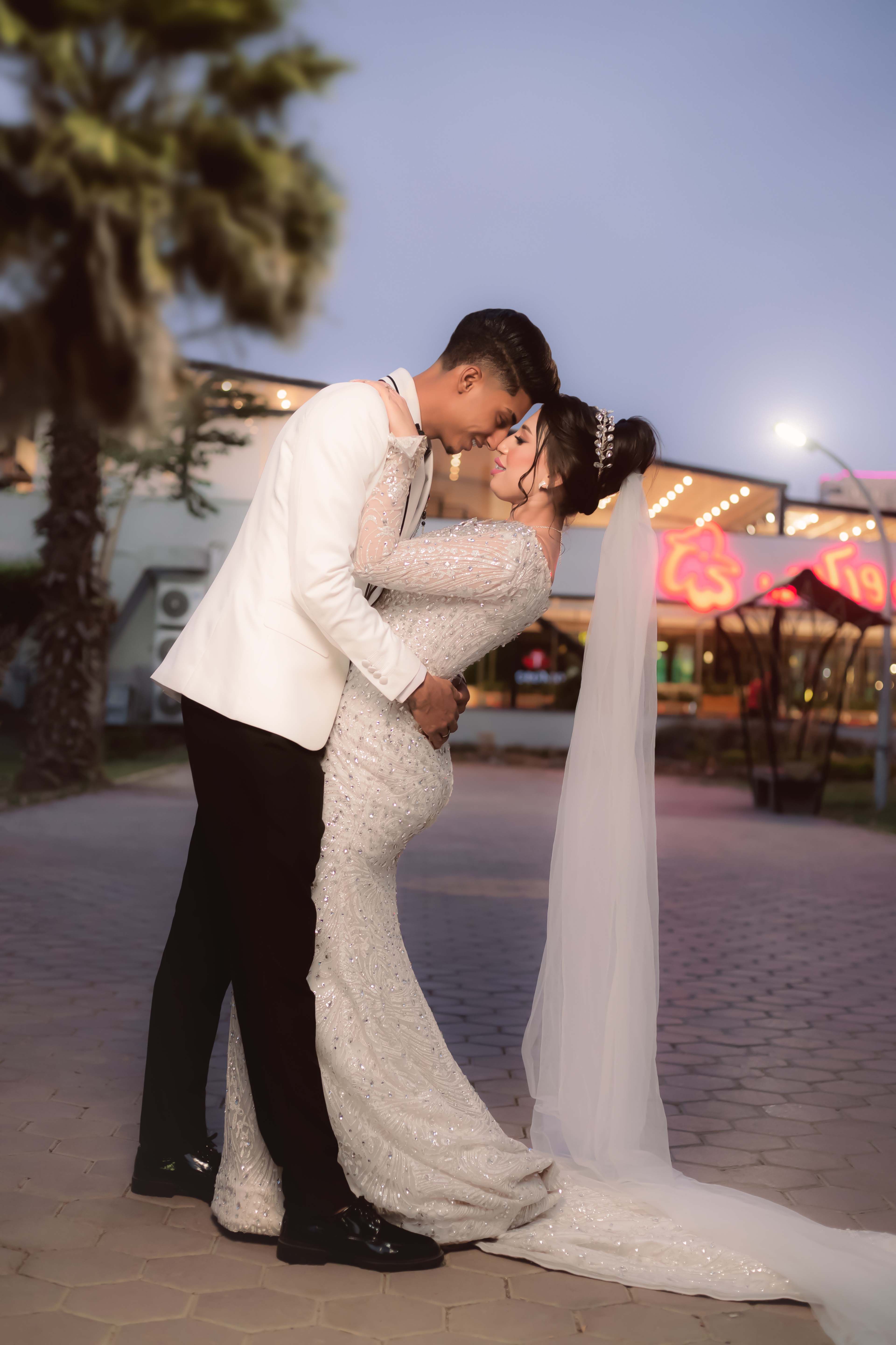 Romantic Outdoor Evening Wedding Kiss · Free Stock Photo