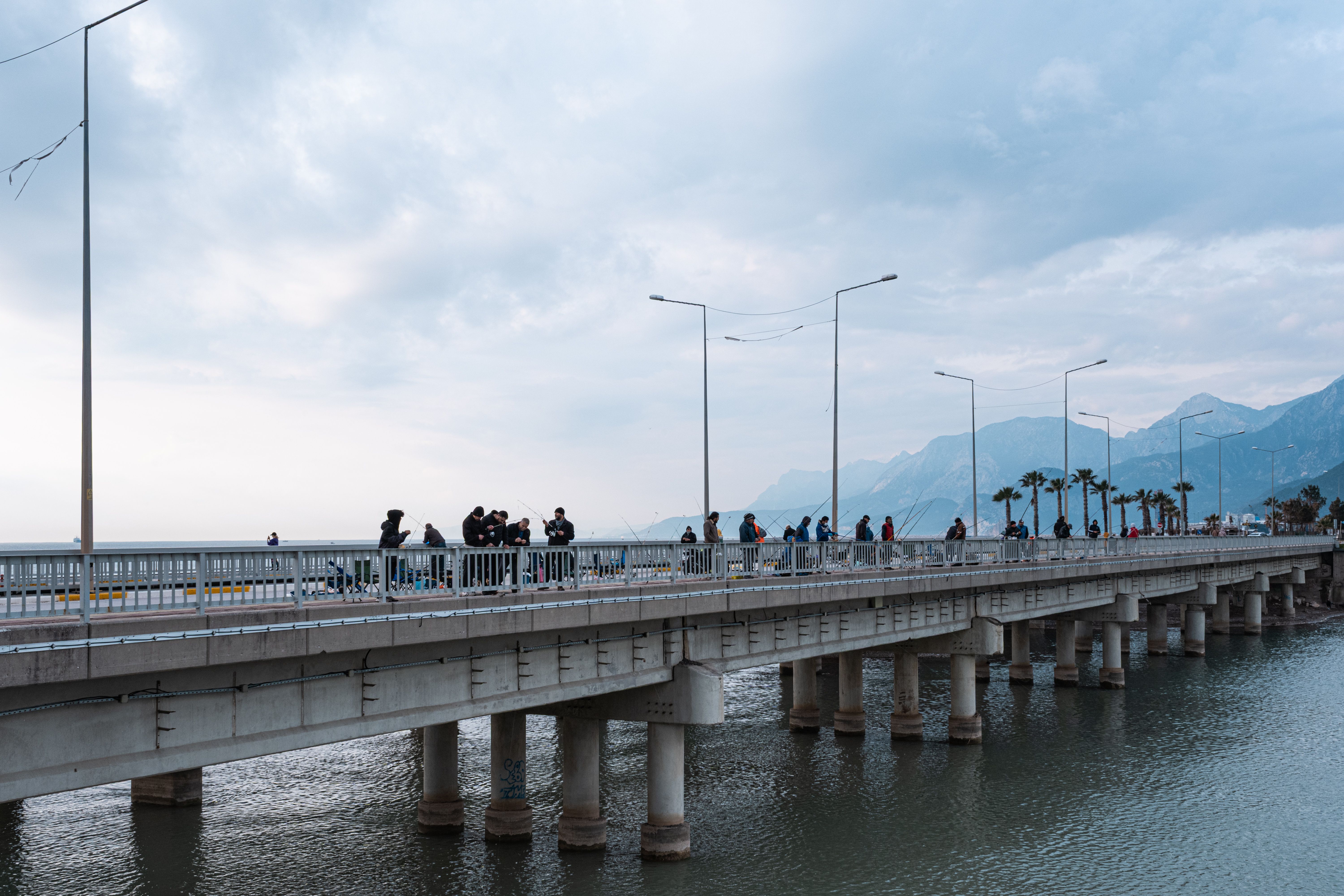 Scenic View of Bridge with People at Sunset · Free Stock Photo