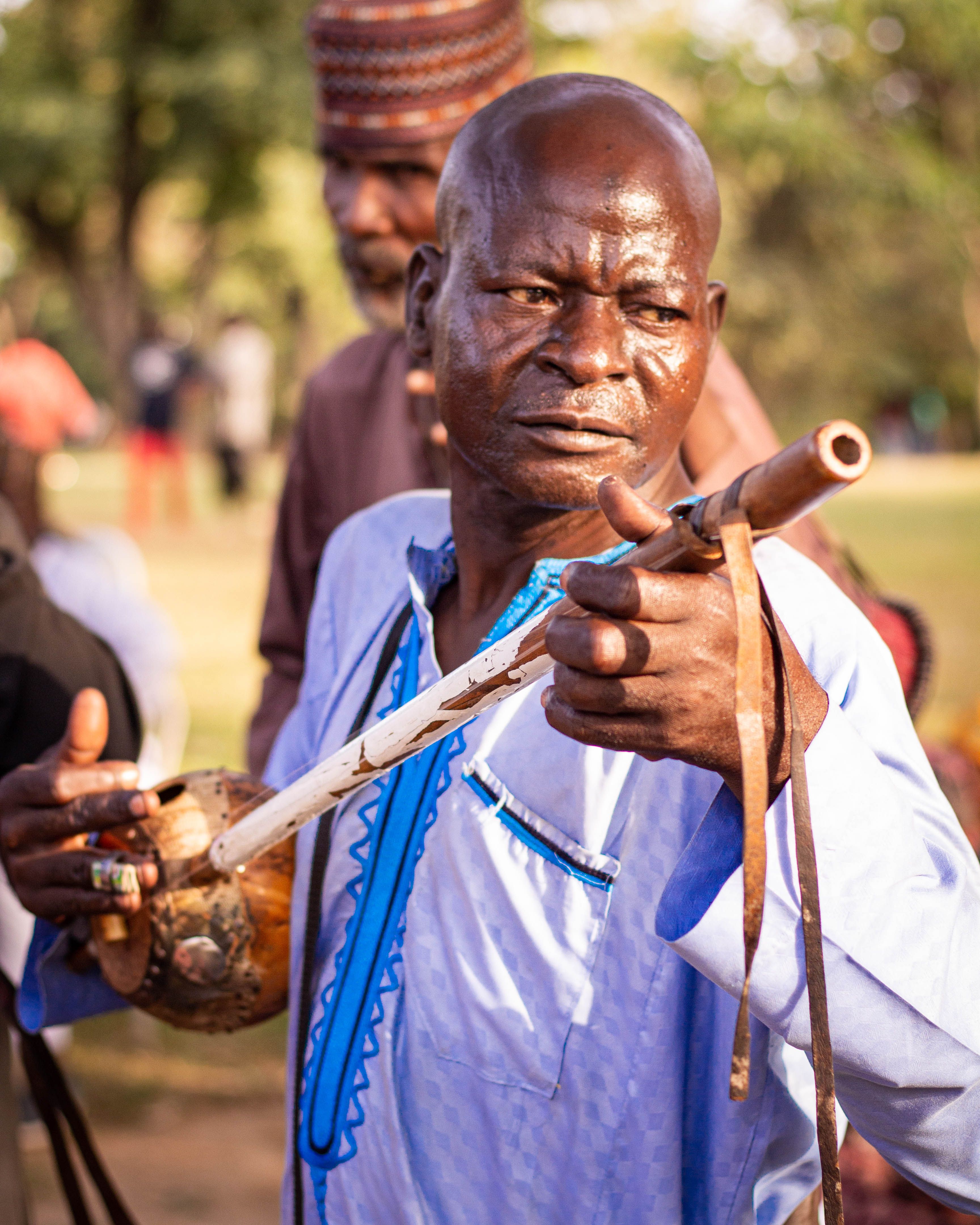 African musician playing traditional instrument · Free Stock Photo