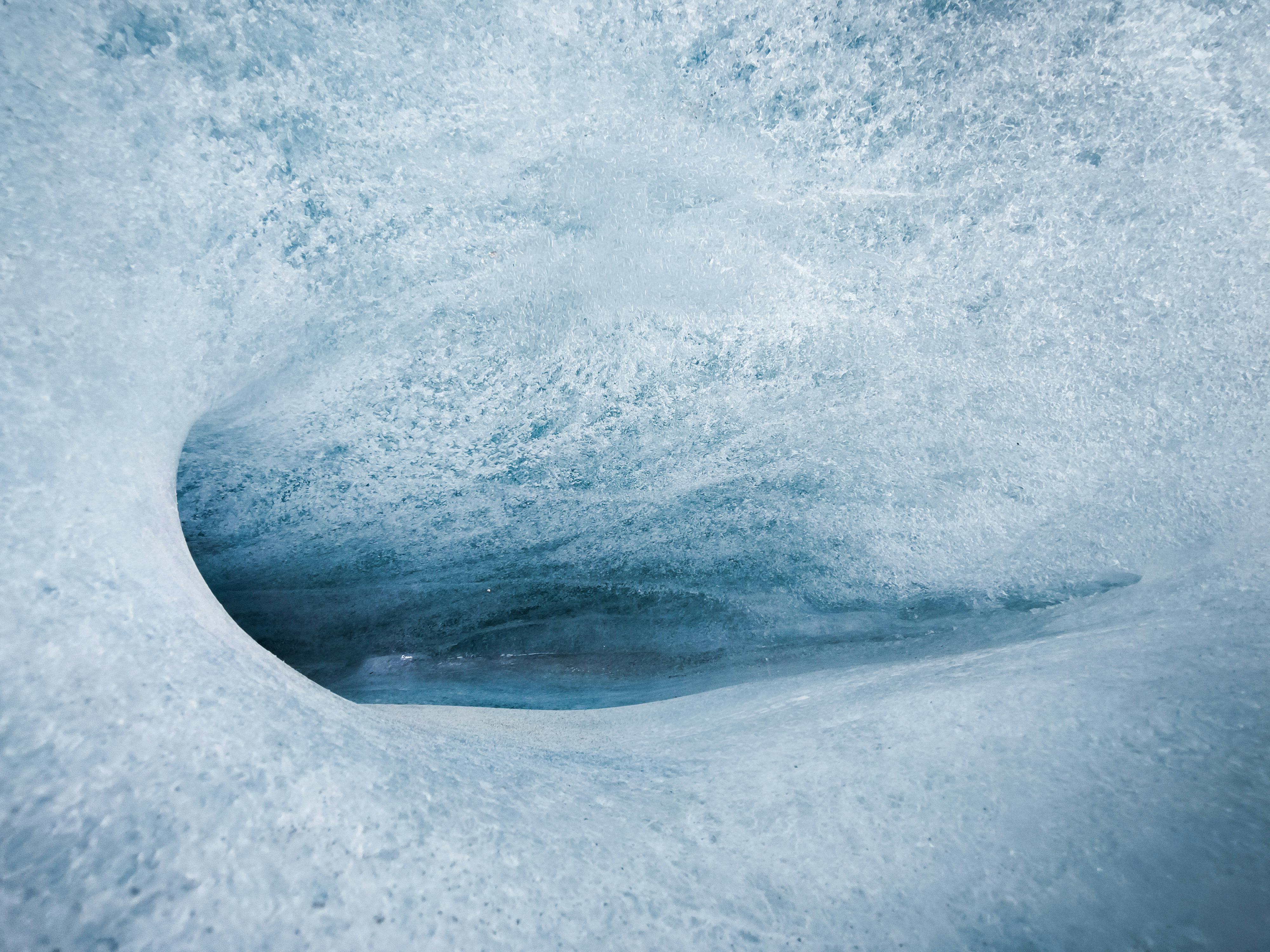 Captivating Ice Tunnel with Textured Walls · Free Stock Photo