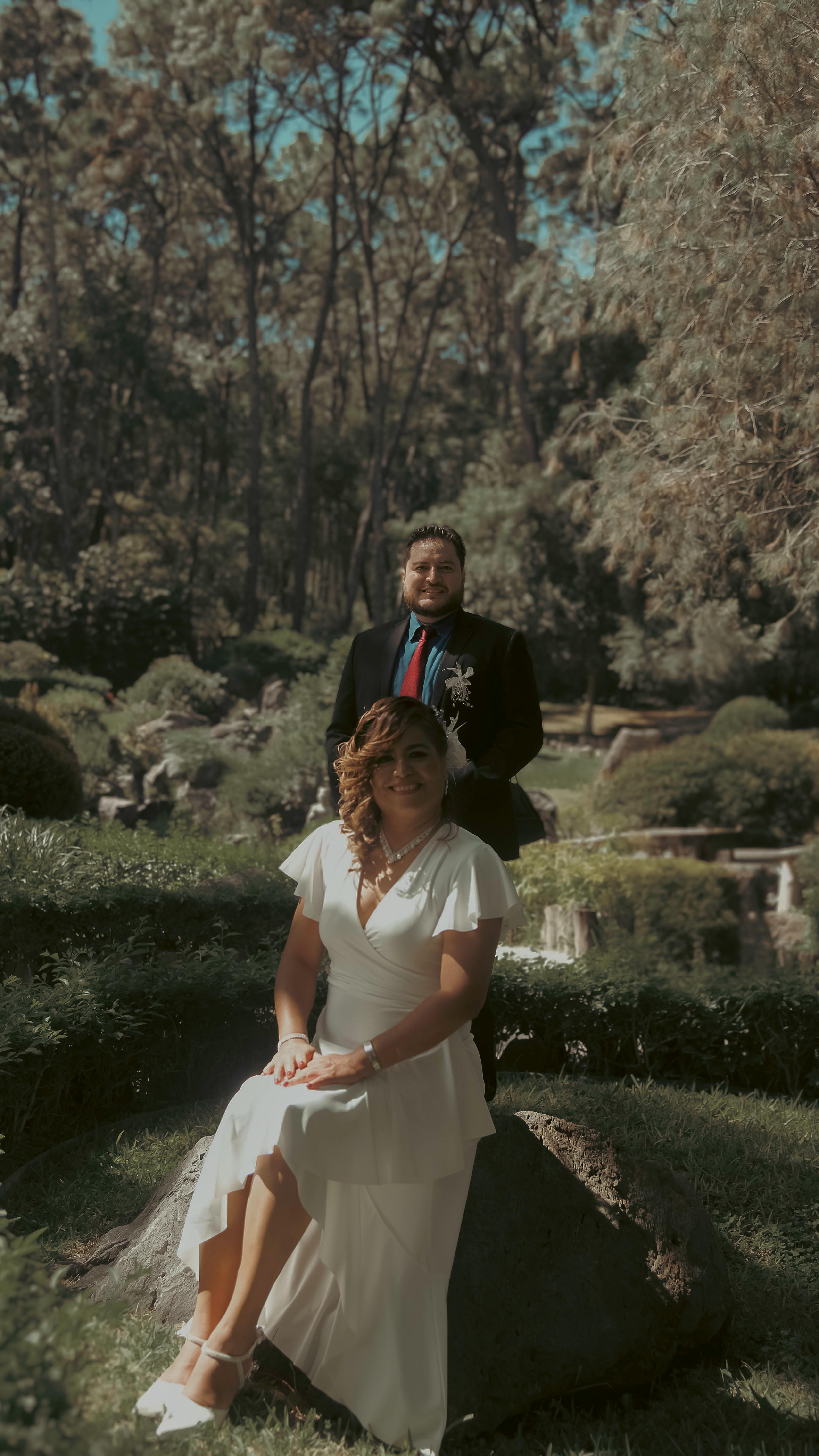 Elegant Outdoor Wedding Portrait in Lush Garden · Free Stock Photo