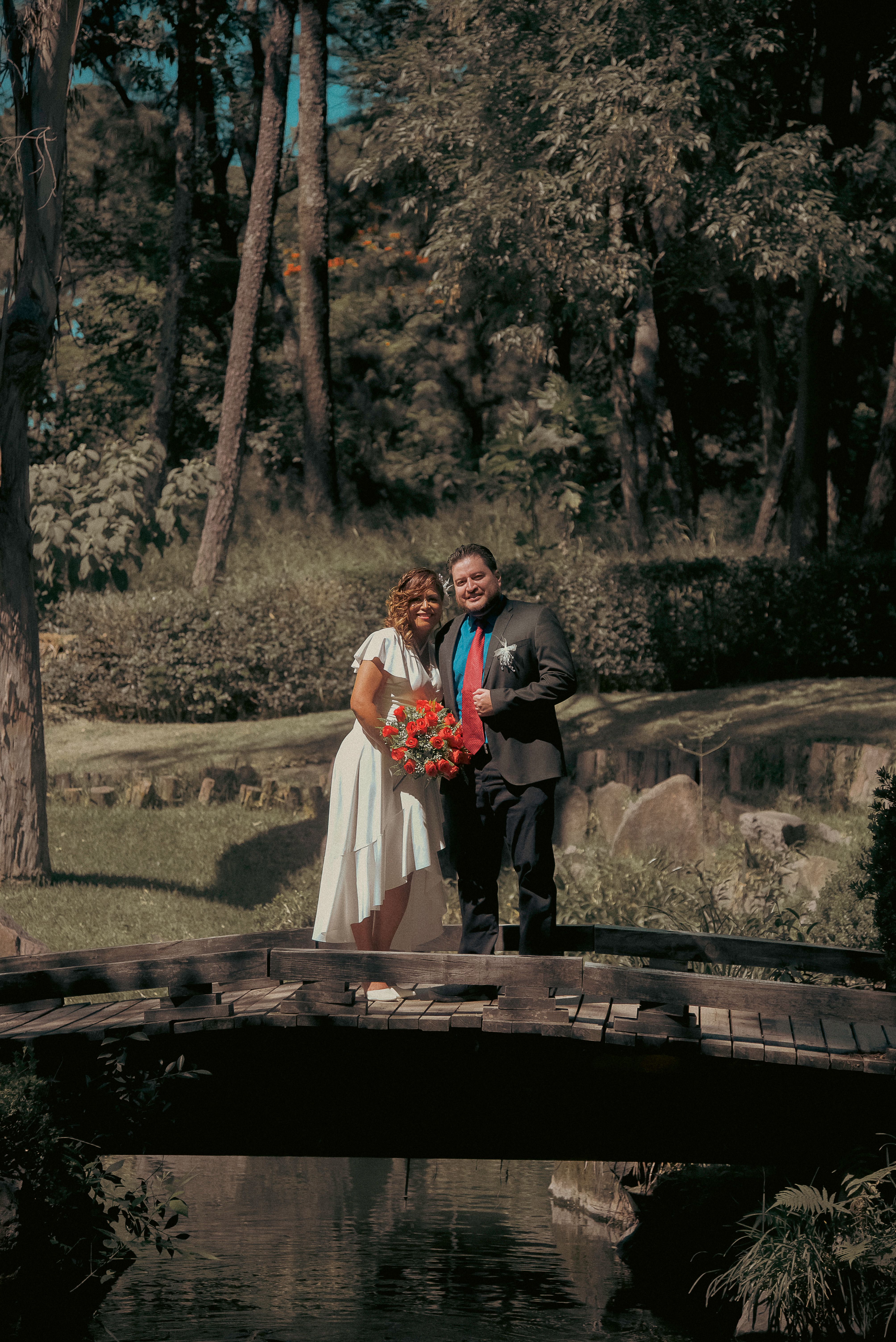 Elegant Outdoor Wedding Portrait in Lush Garden · Free Stock Photo