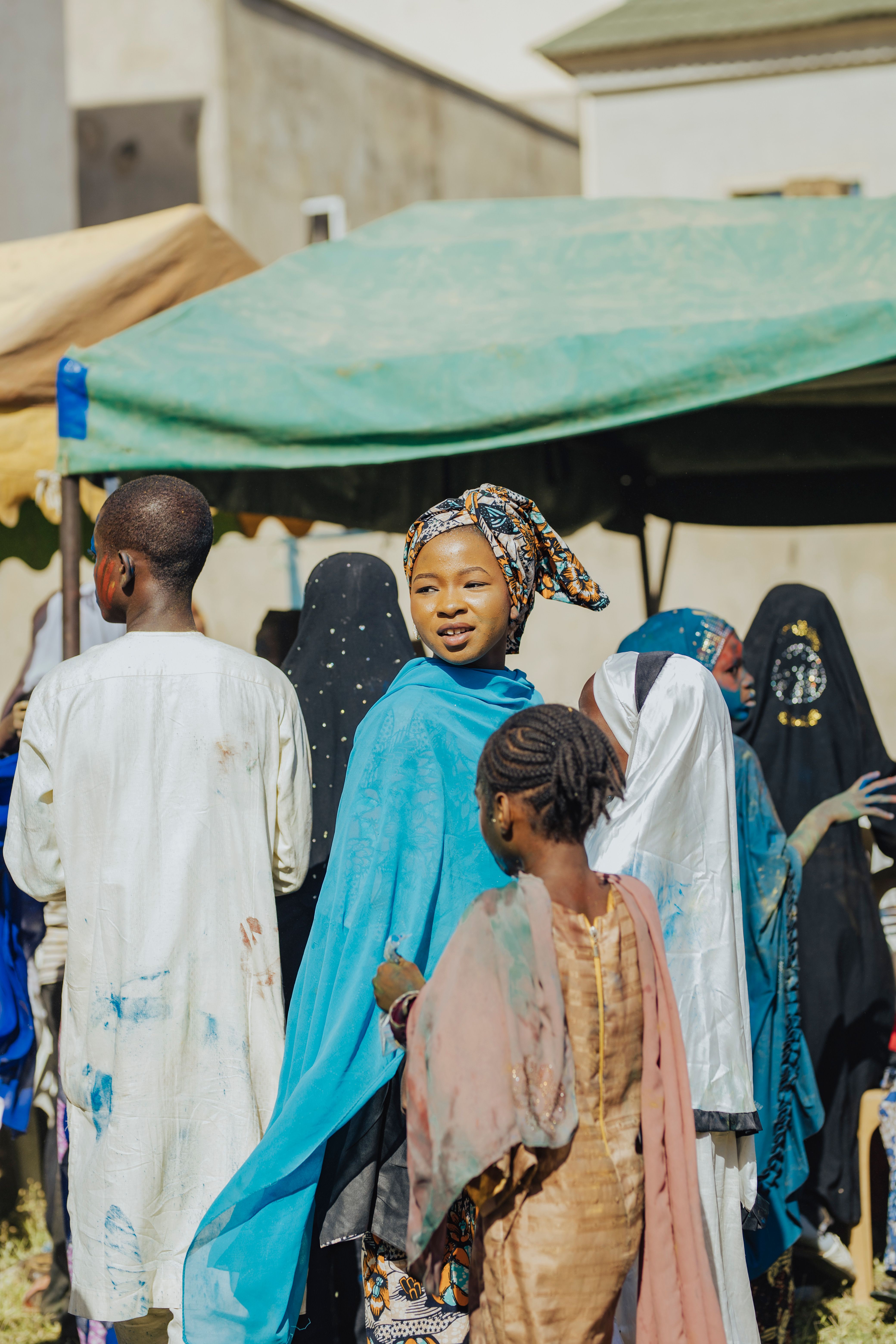 Cultural Gathering with Traditional Attire Outdoors · Free Stock Photo
