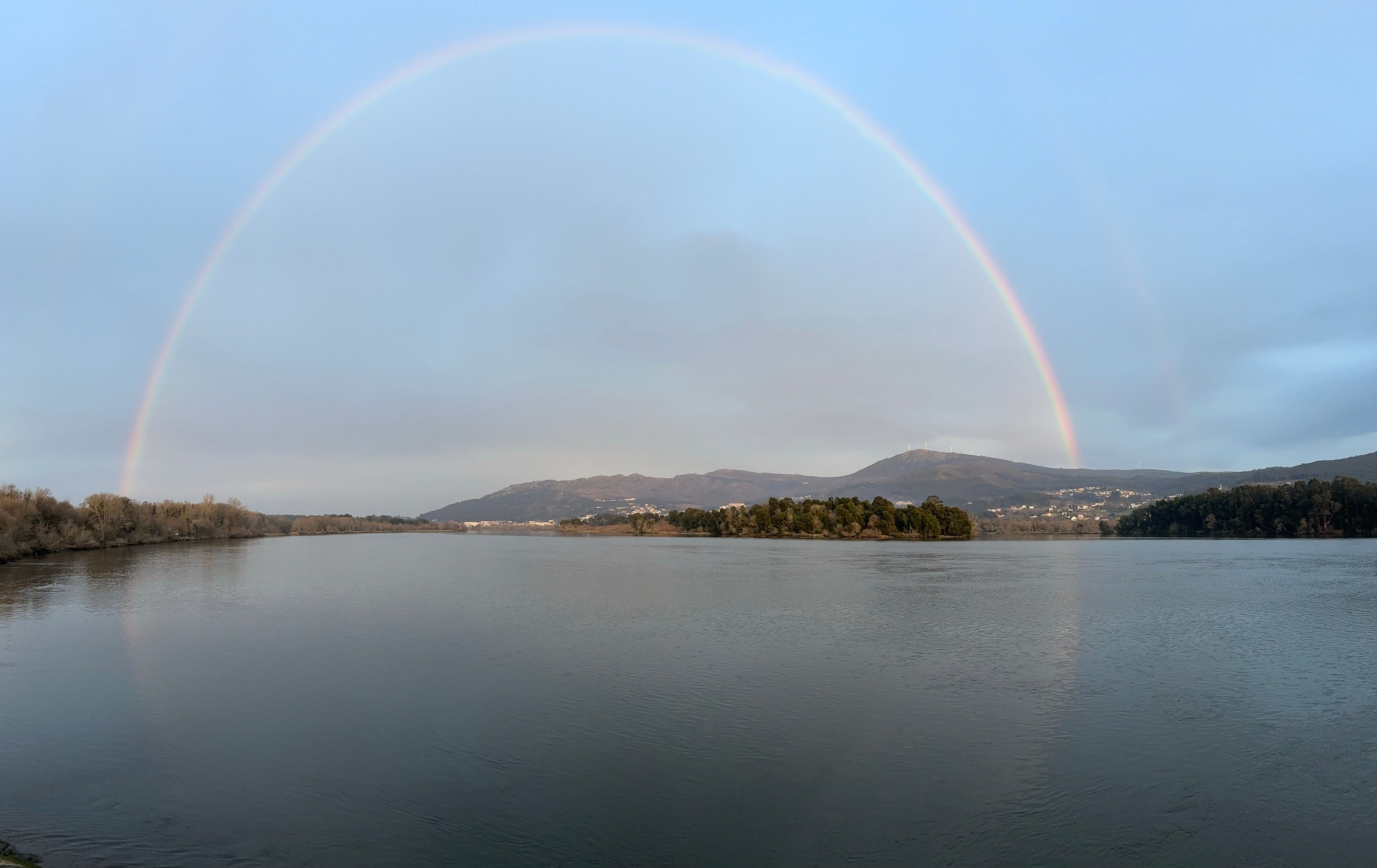 Breathtaking Rainbow over Tranquil River · Free Stock Photo