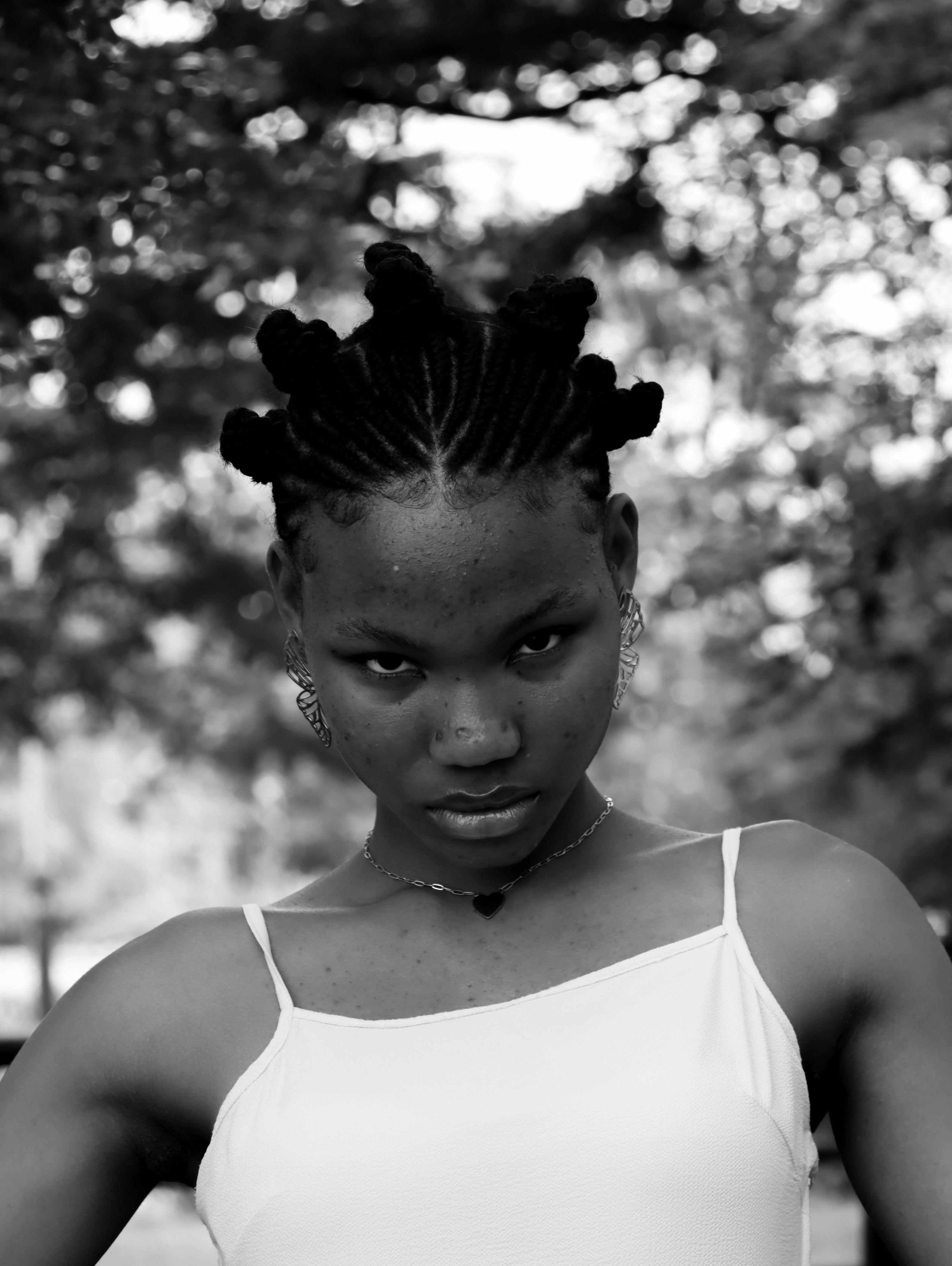 Portrait of Woman with Bantu Knots in Park Setting · Free Stock Photo