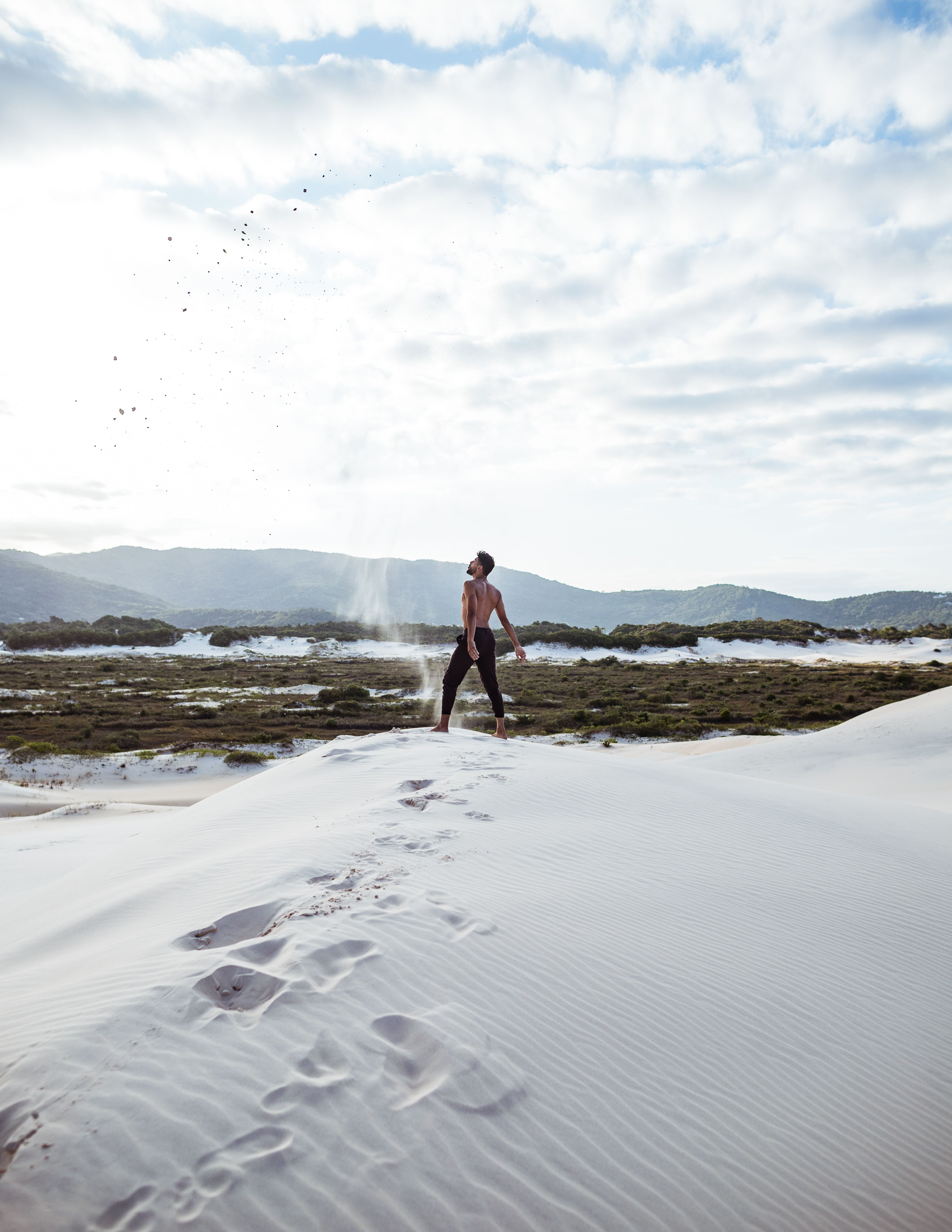 Man Standing on Plateau With Arms Wide Open · Free Stock Photo
