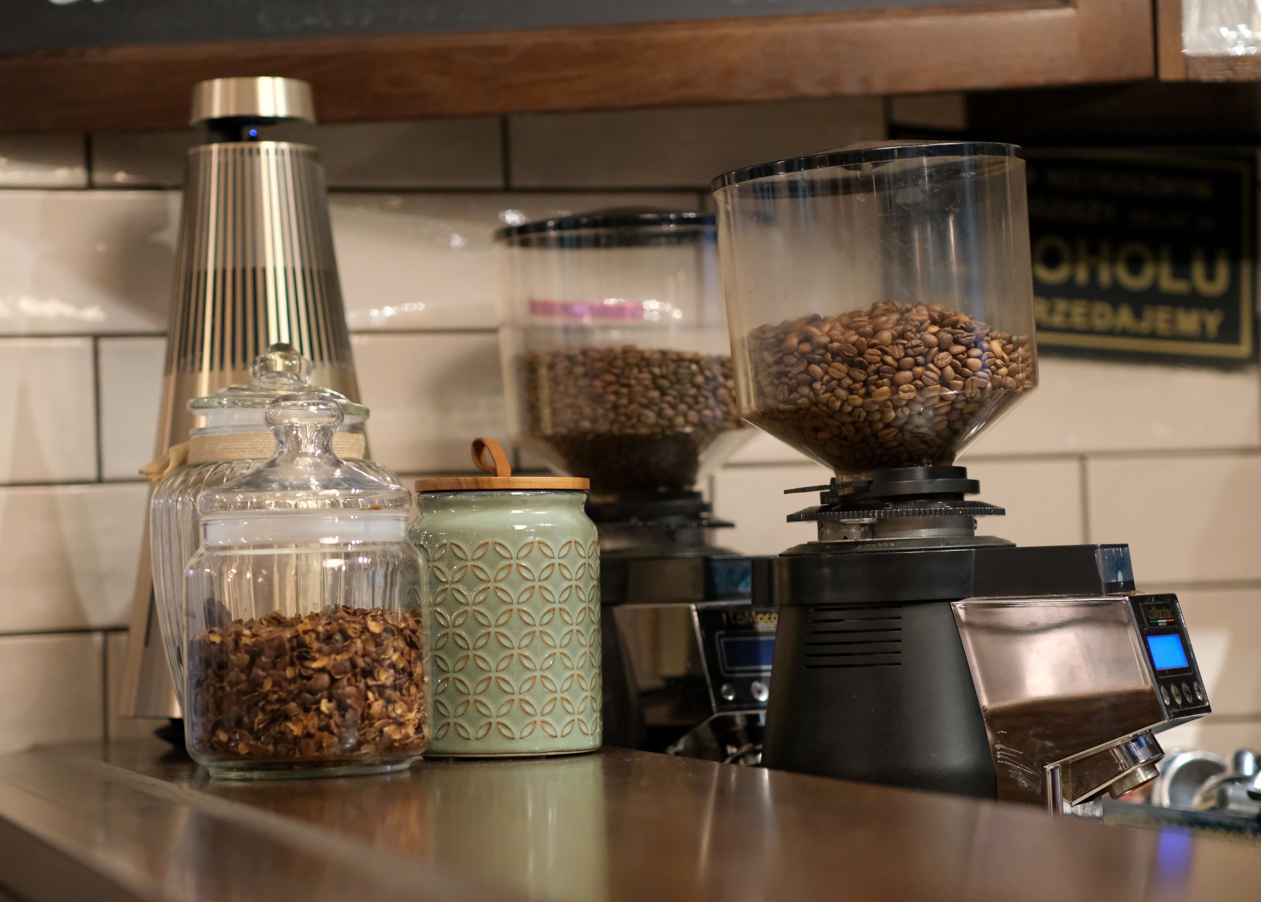 Close-Up of Coffee Grinder and Jars in Café · Free Stock Photo