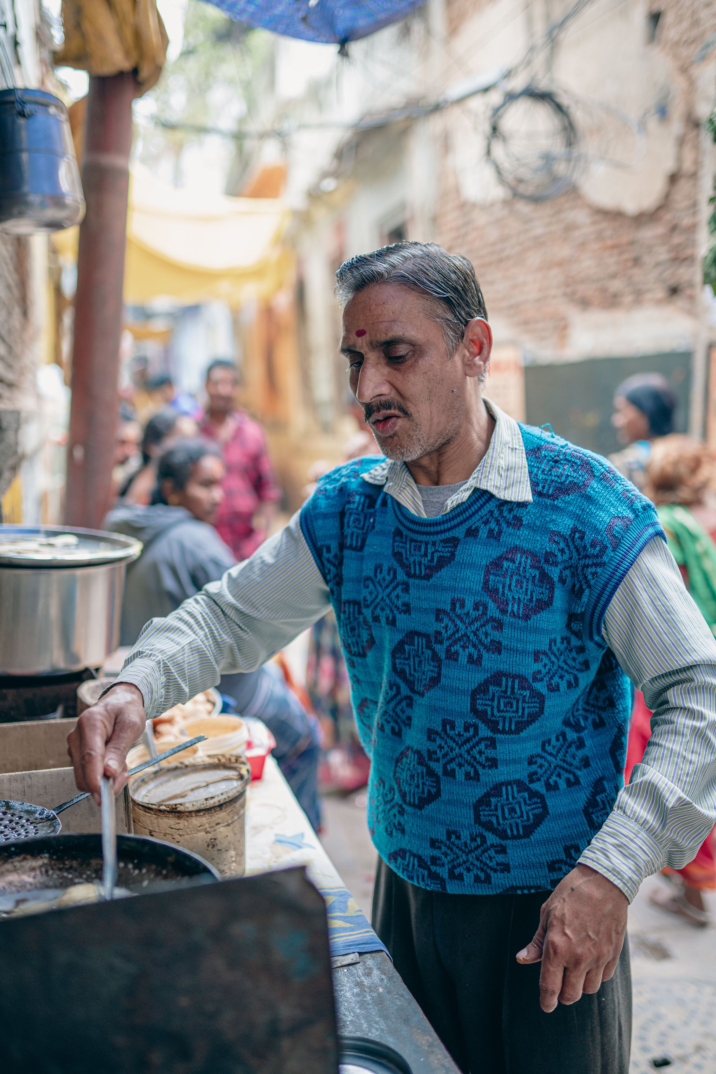 Street Vendor Cooking in Varanasi Alley · Free Stock Photo