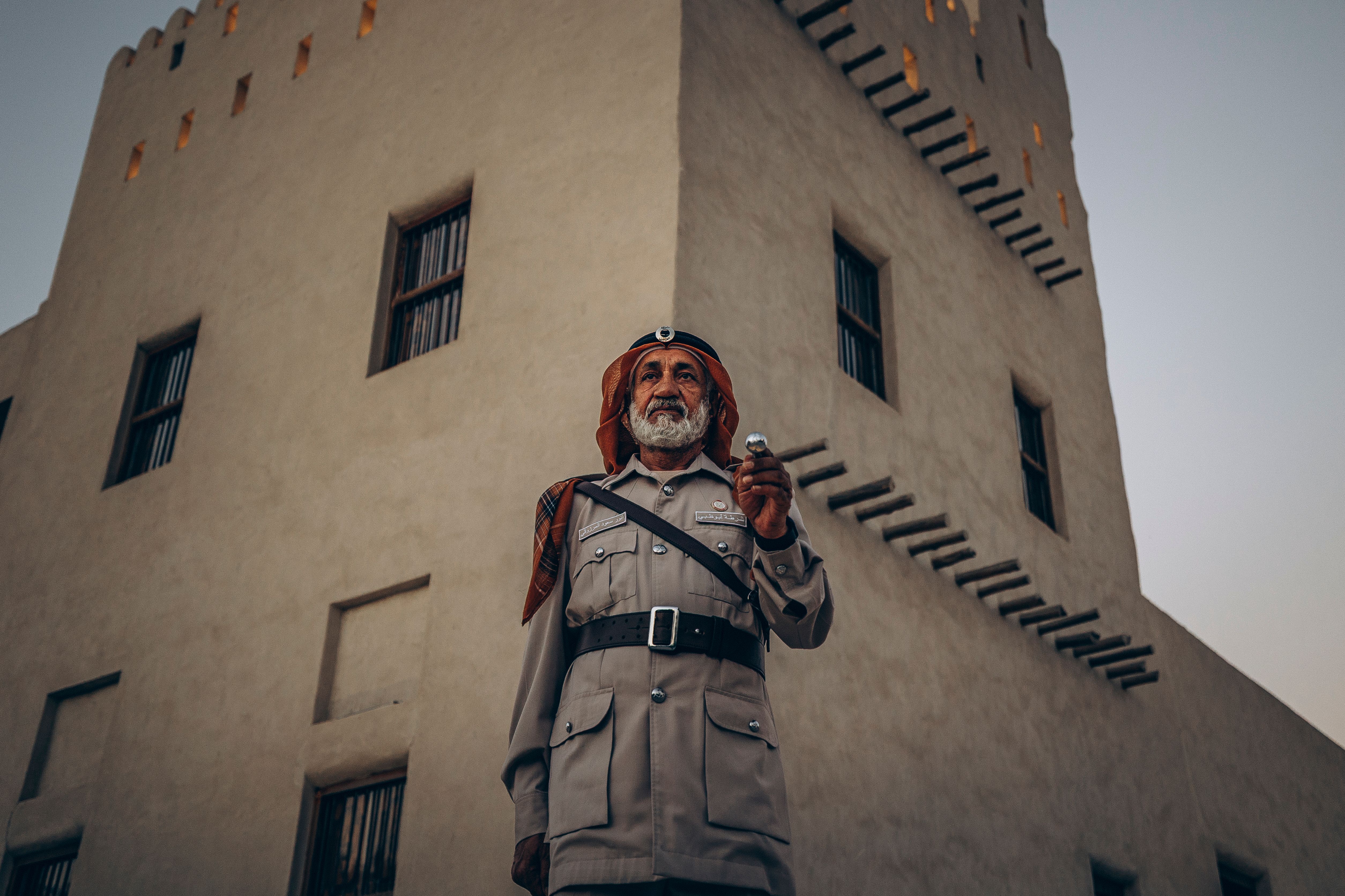 Traditional Guard by Abu Dhabi Heritage Building · Free Stock Photo
