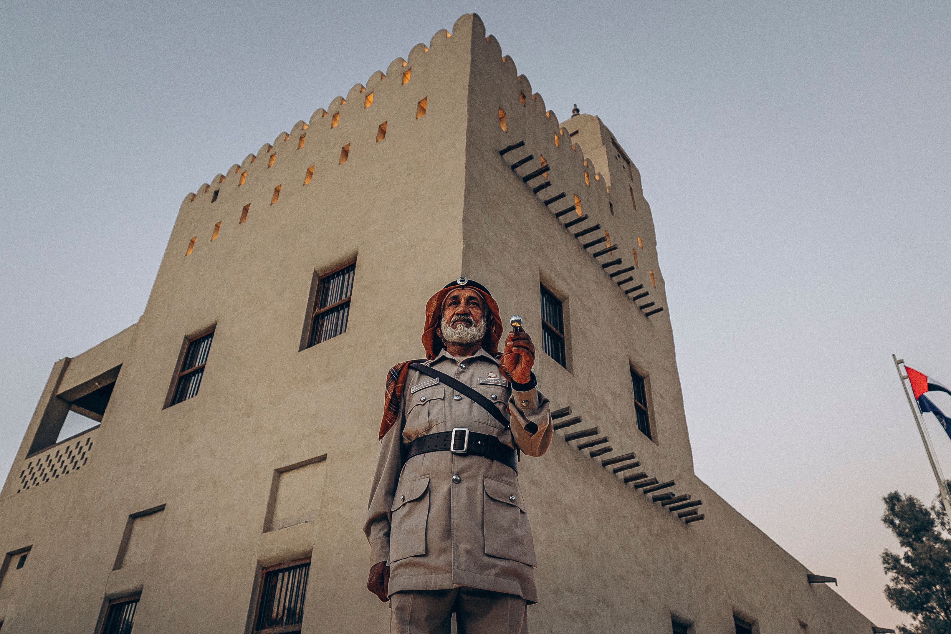 Traditional UAE Guard at Heritage Building · Free Stock Photo