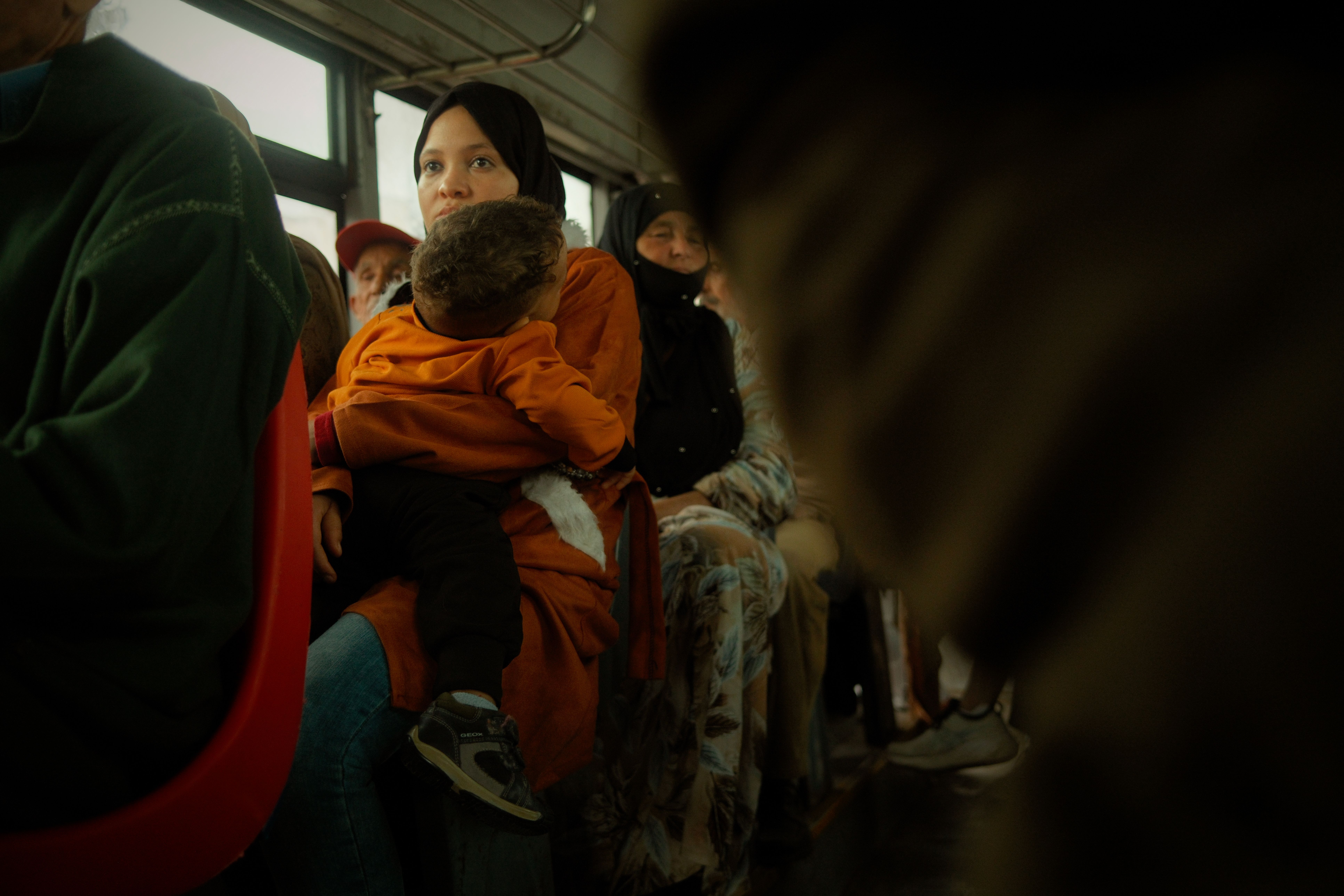 Mother and Child on a Moroccan Bus Ride · Free Stock Photo