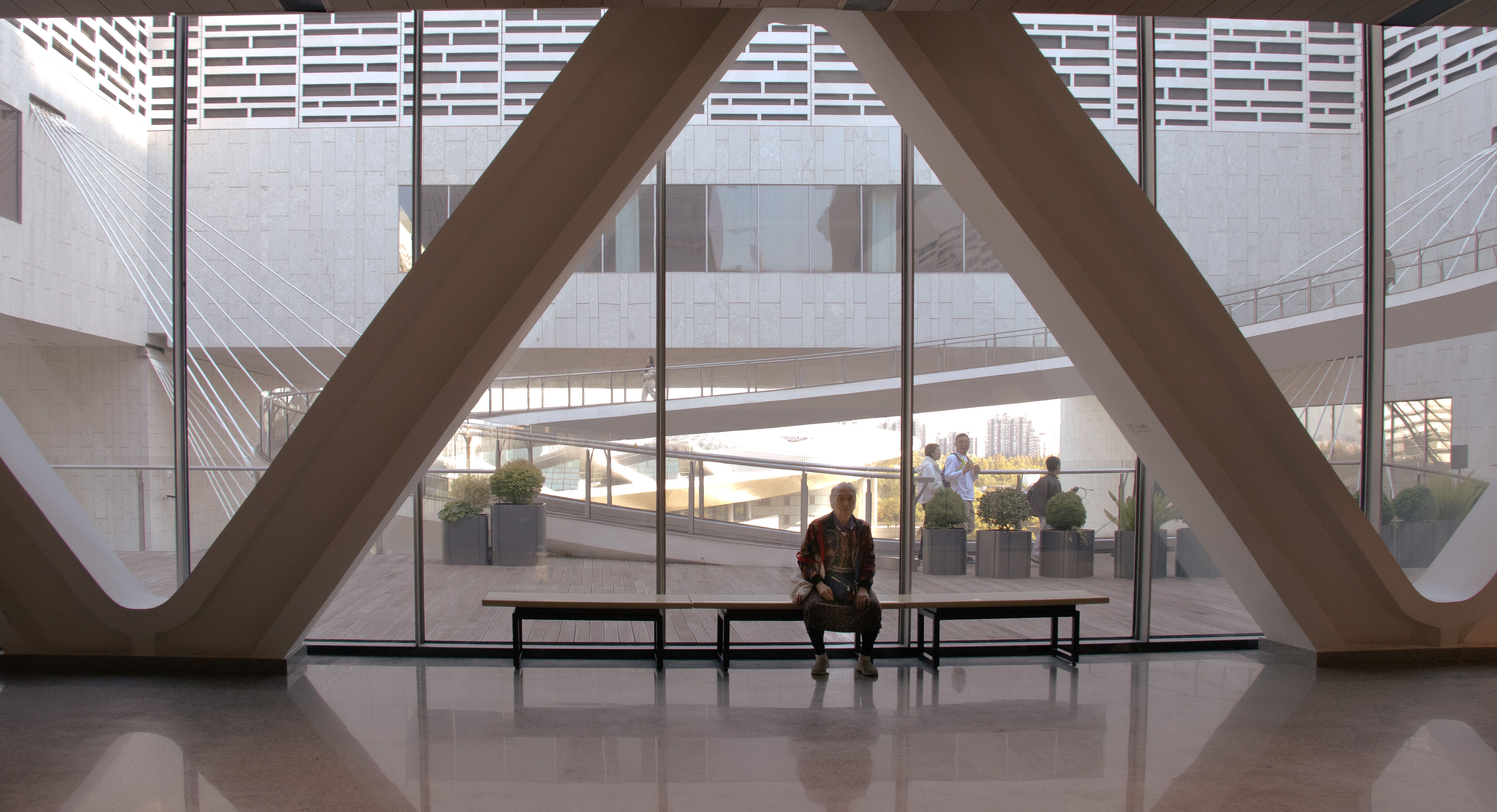 Modern Architecture Interior with Seated Figure · Free Stock Photo