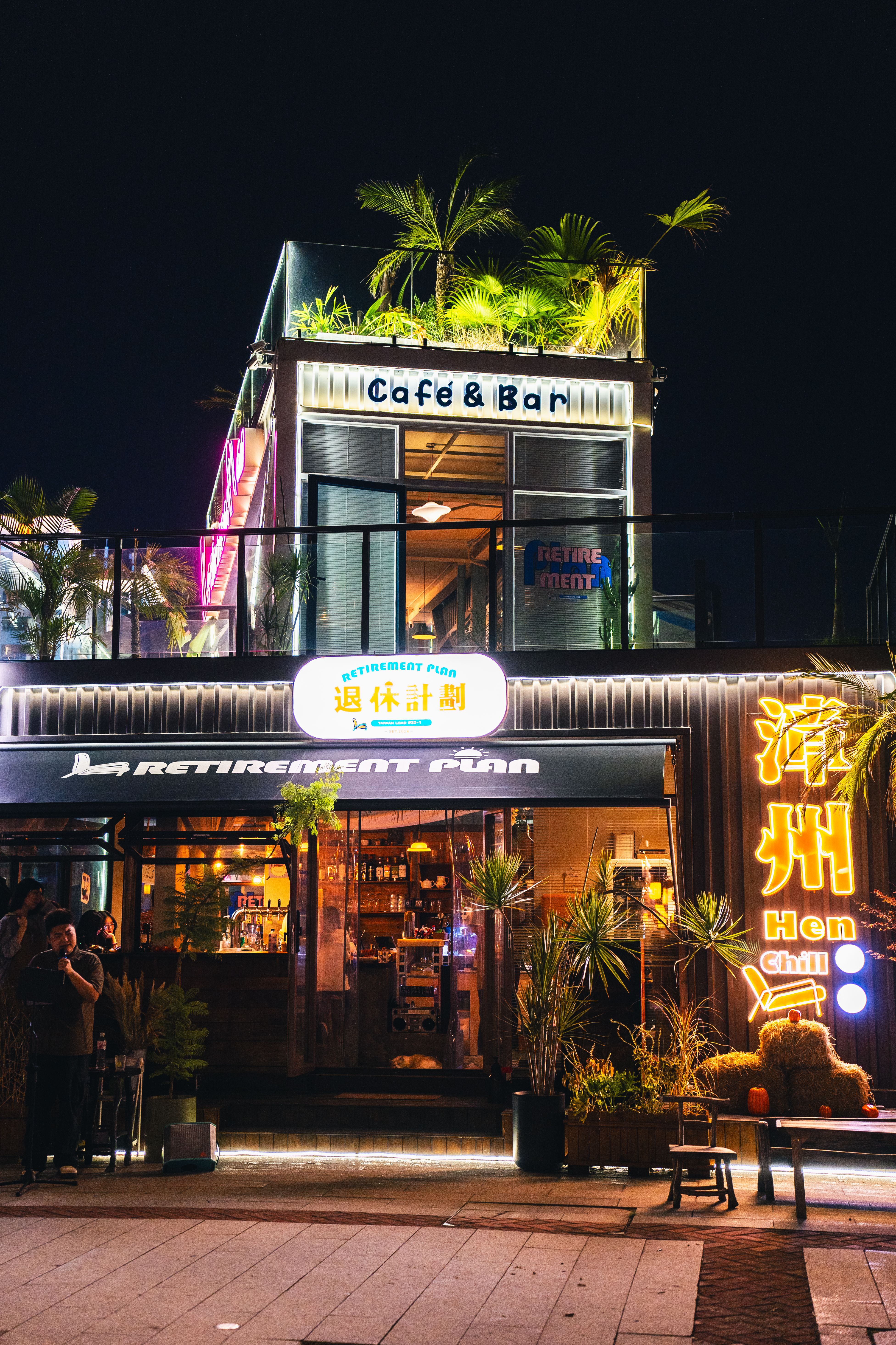 Vibrant Nightlife at Illuminated Cafe Bar · Free Stock Photo