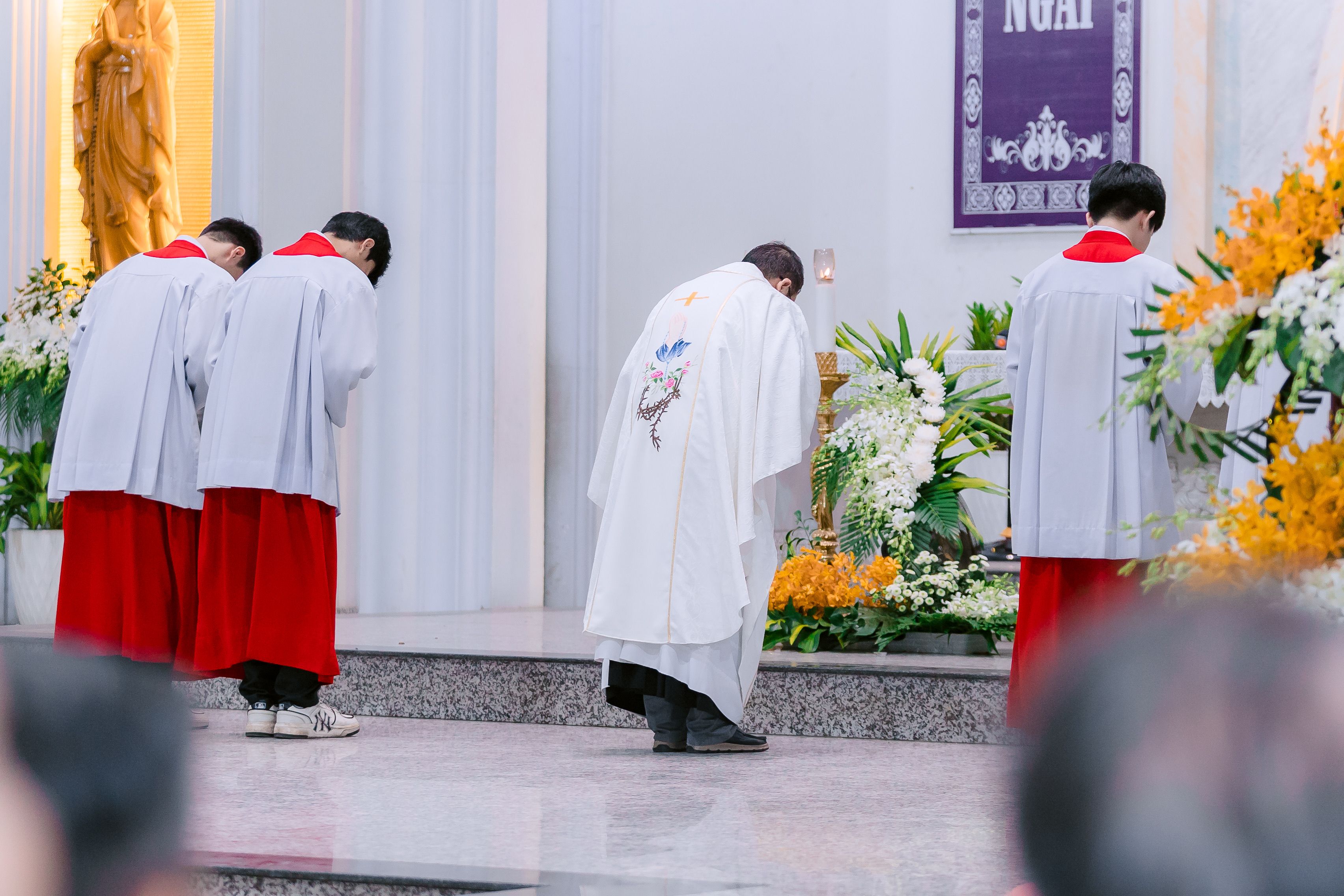 Religious Ceremony with Priests Bowing Indoors · Free Stock Photo