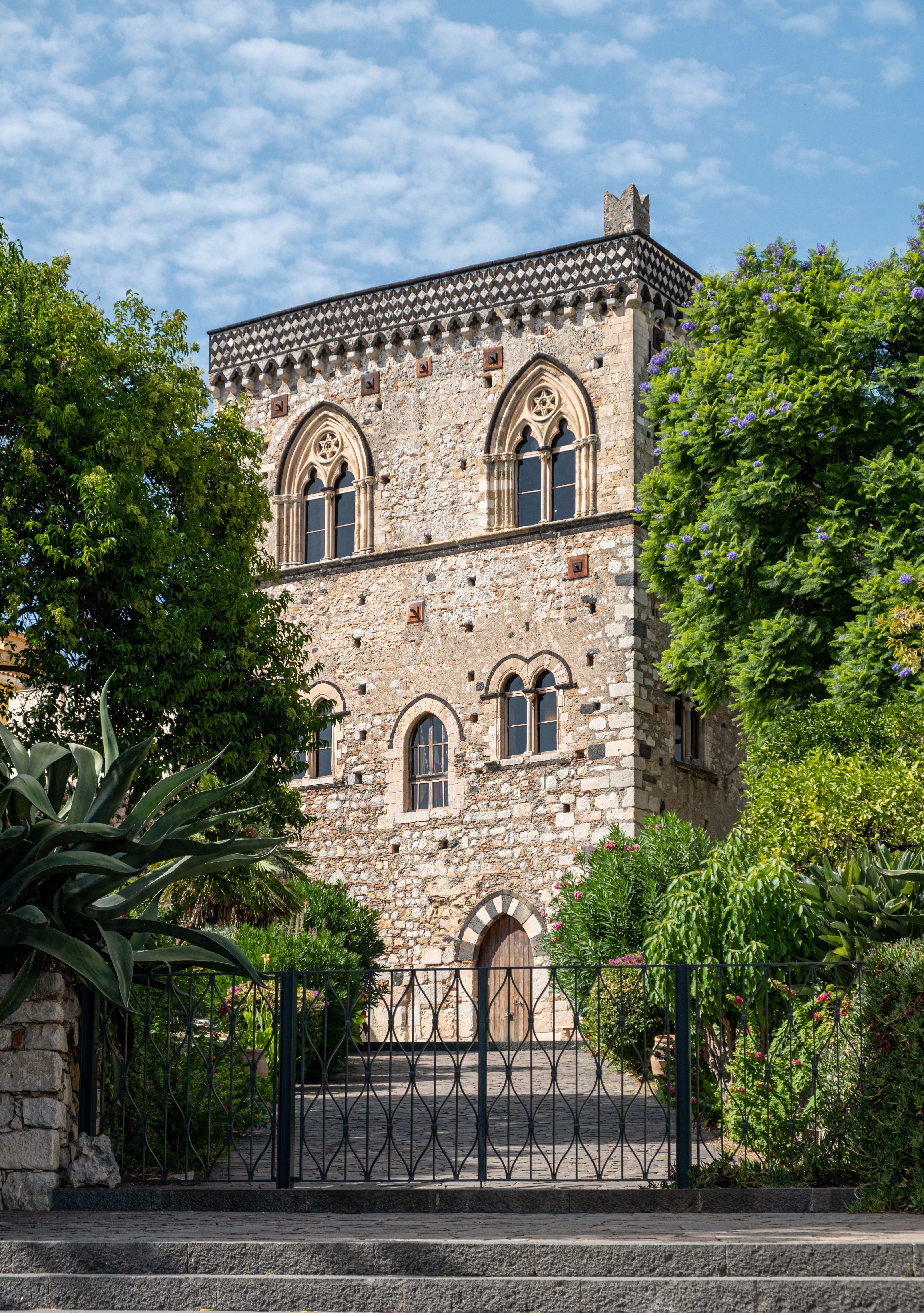 Historic Stone Building with Lush Courtyard · Free Stock Photo