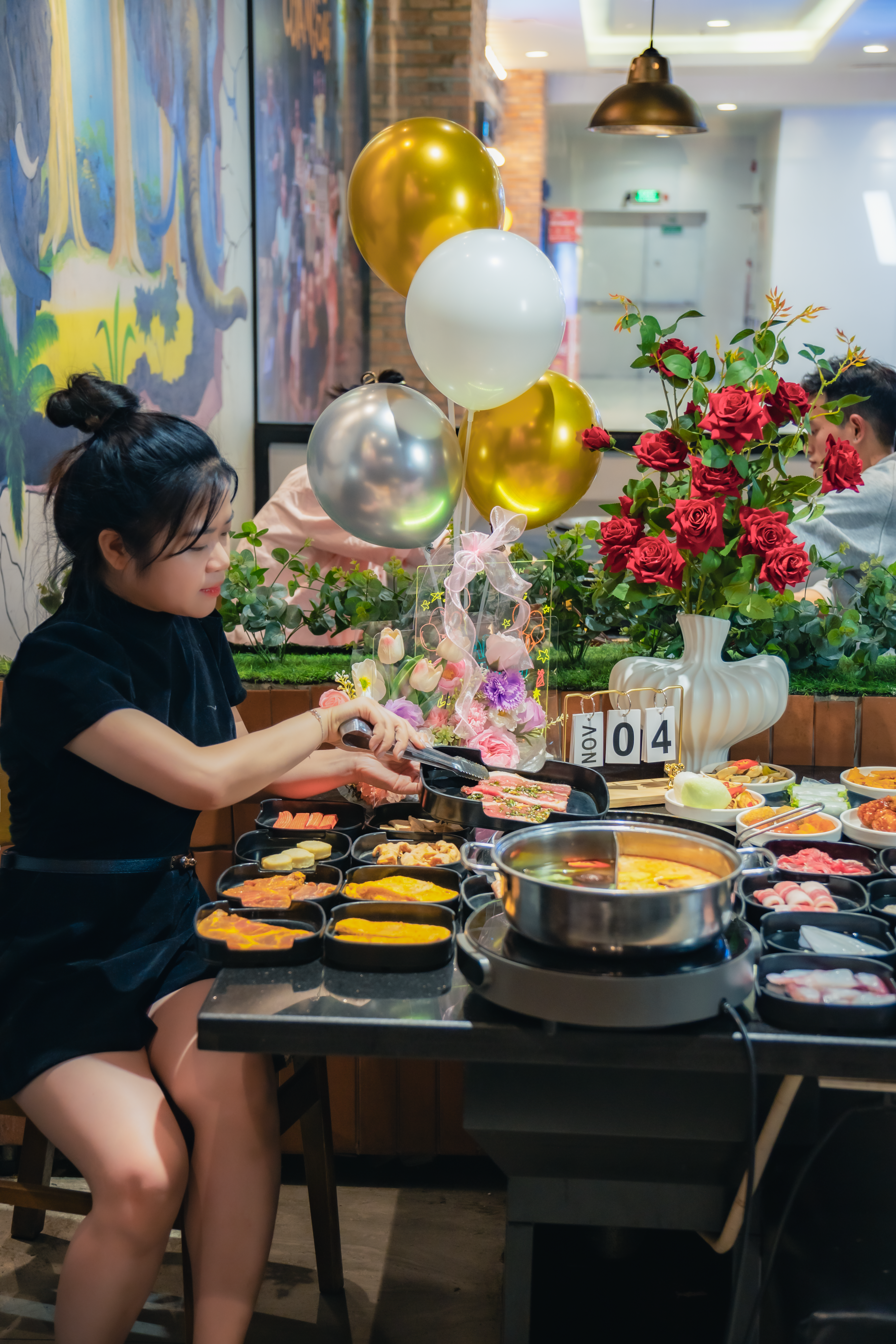 Young Woman Enjoying Hot Pot Delight in Vietnamese Restaurant · Free ...