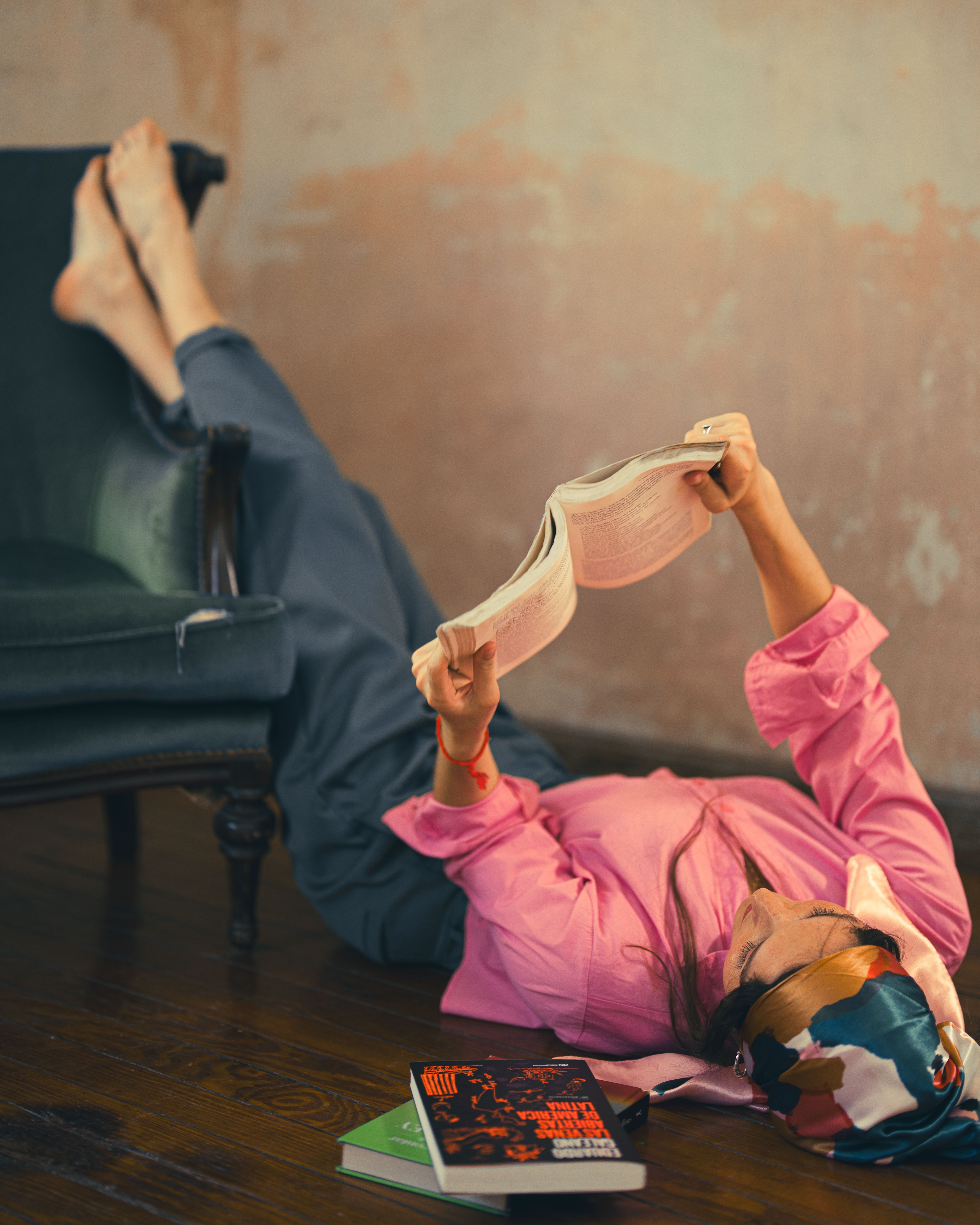 Relaxed Reading Indoors with Cozy Attire · Free Stock Photo