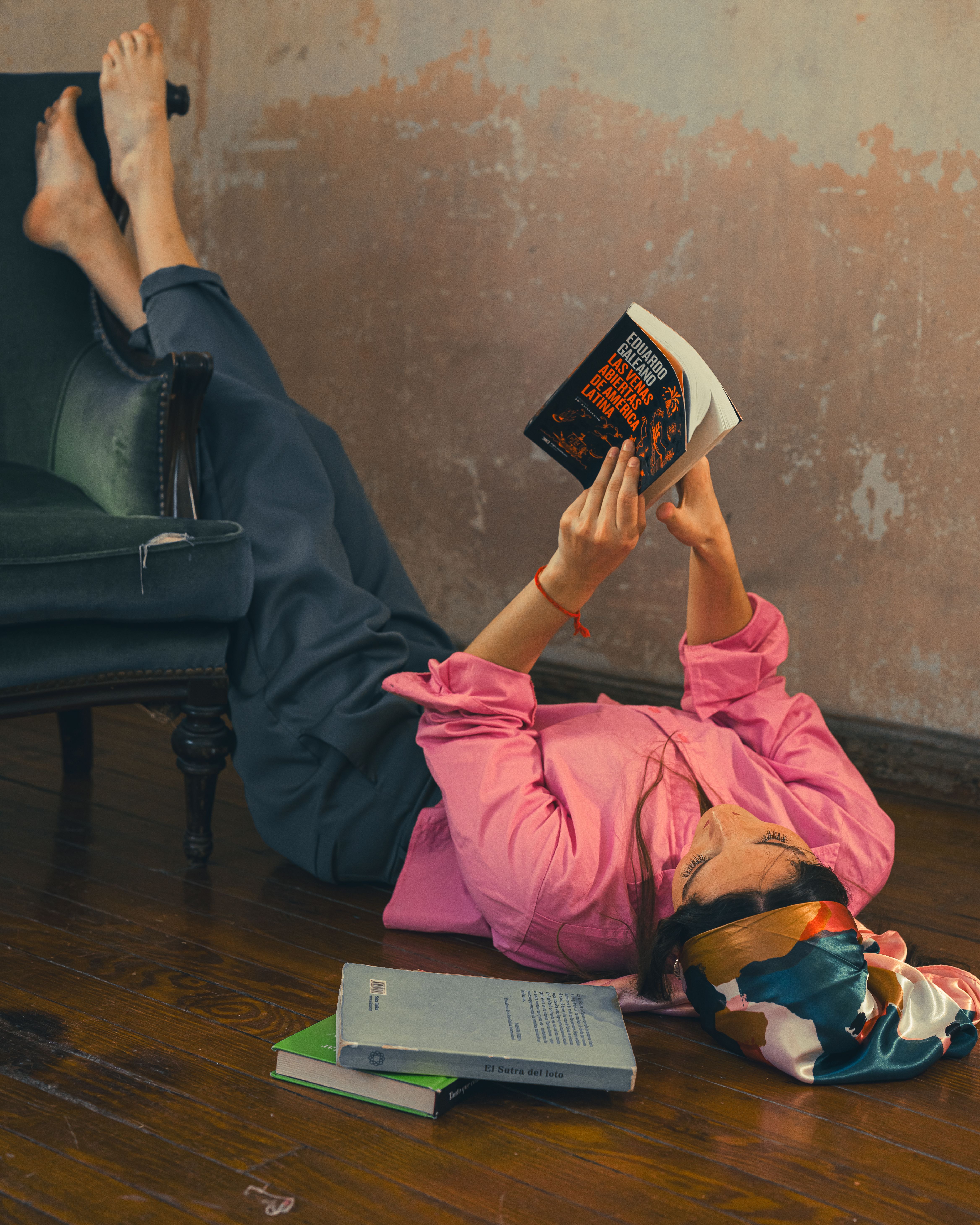 Relaxed Woman Reading on Floor with Books · Free Stock Photo