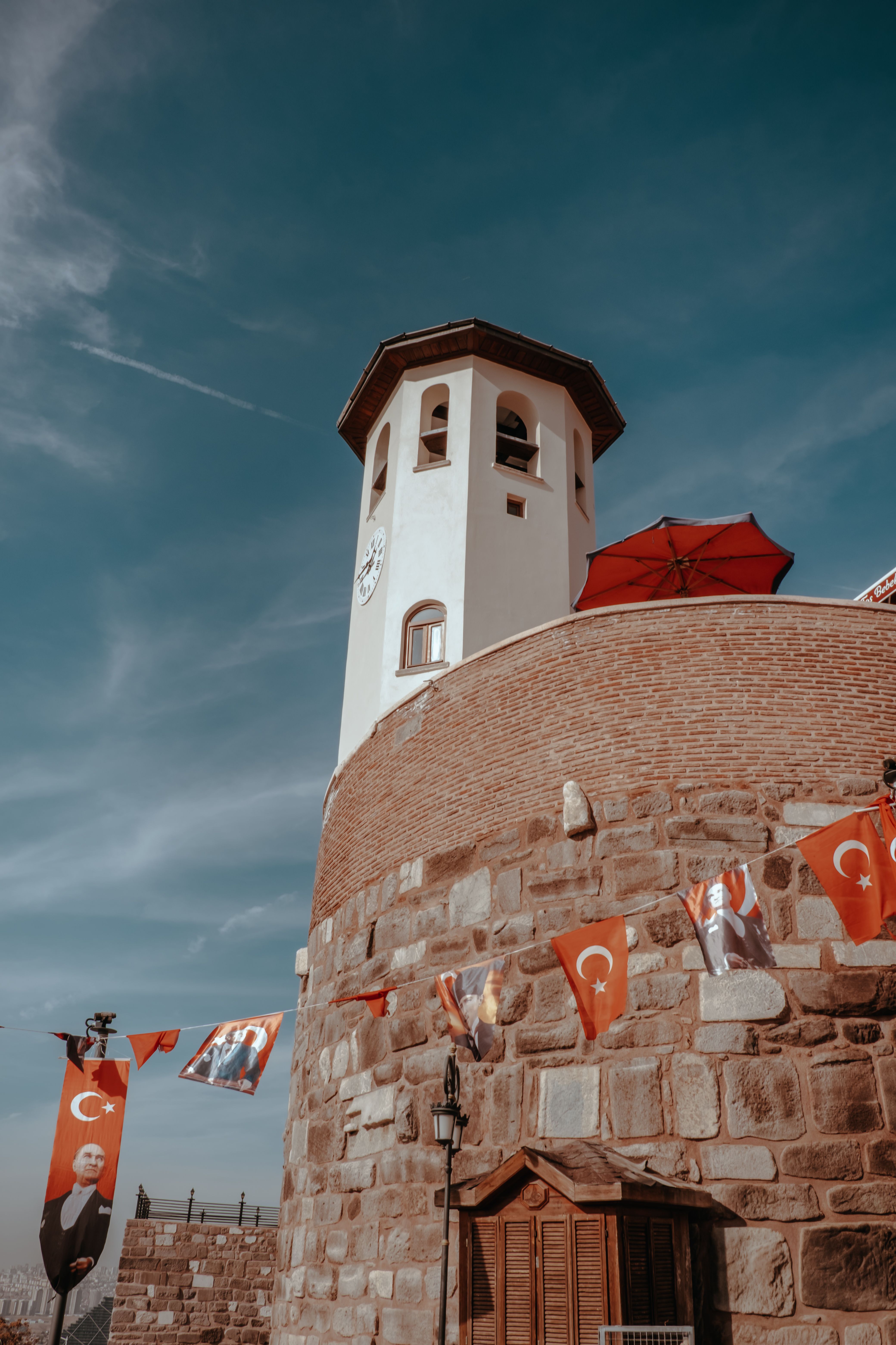 Historic Turkish Tower with National Flags · Free Stock Photo