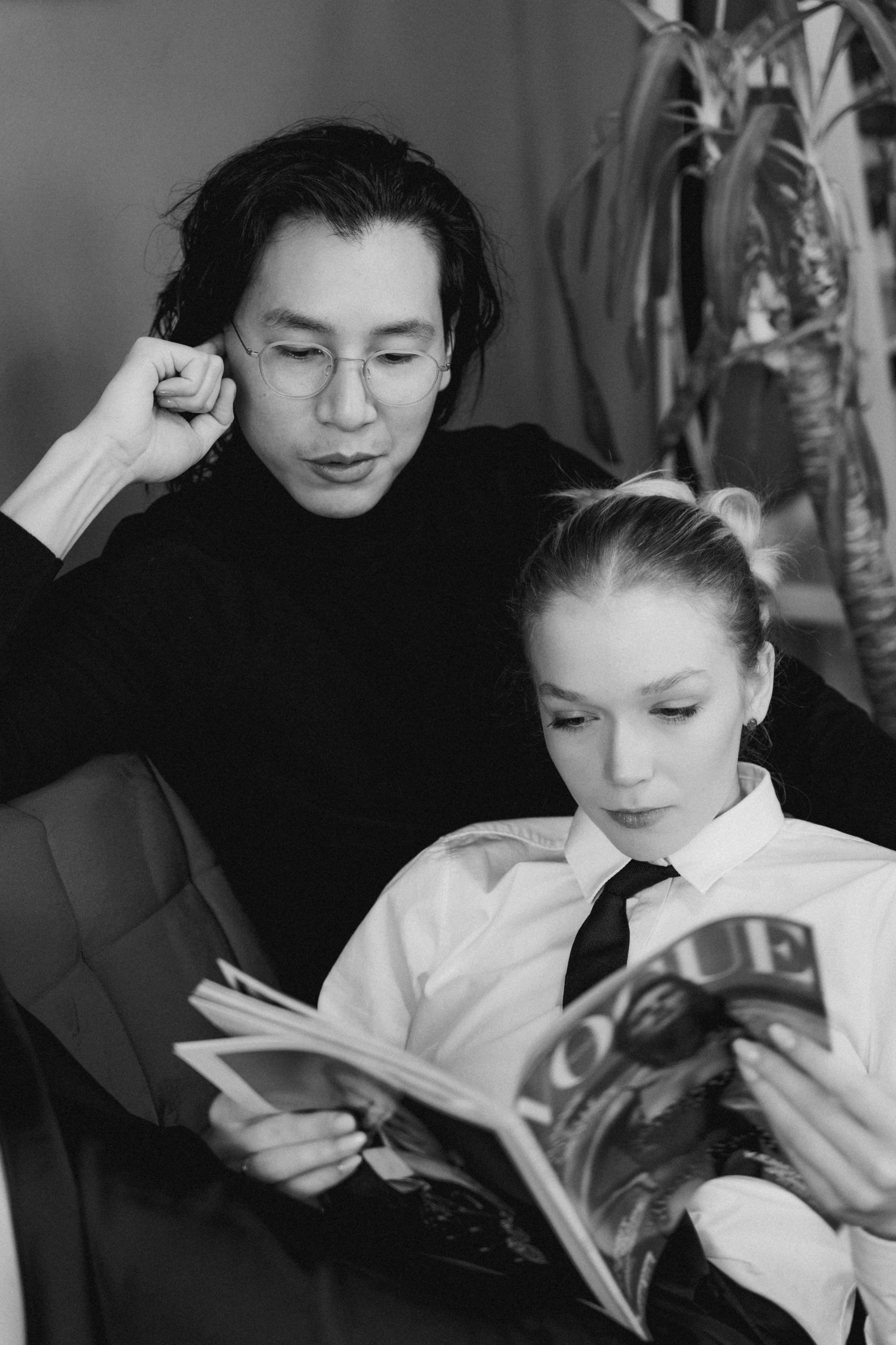 Black and White Portrait of Two People Reading Vogue · Free Stock Photo