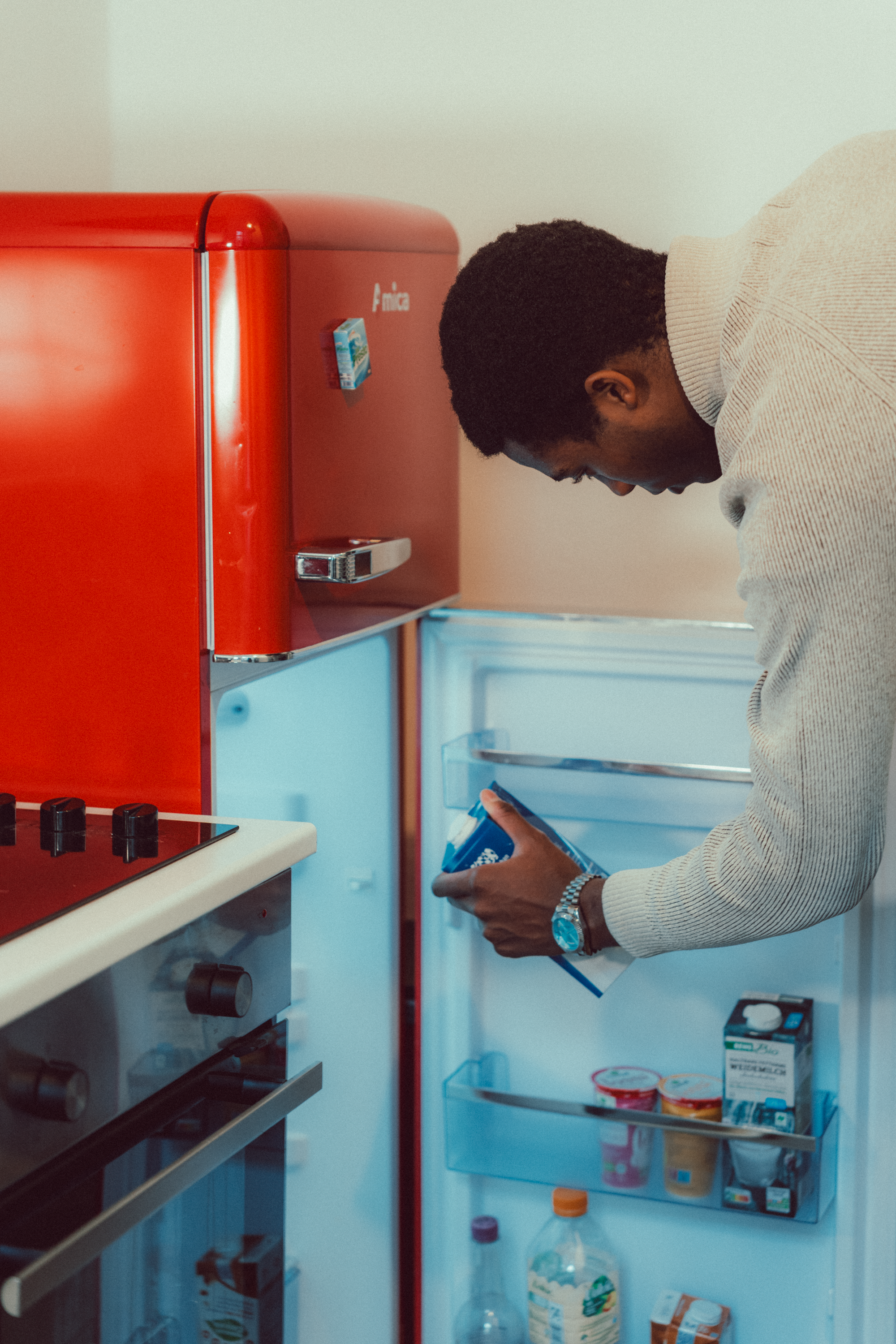 Man Searching Fridge for Food in Modern Kitchen · Free Stock Photo