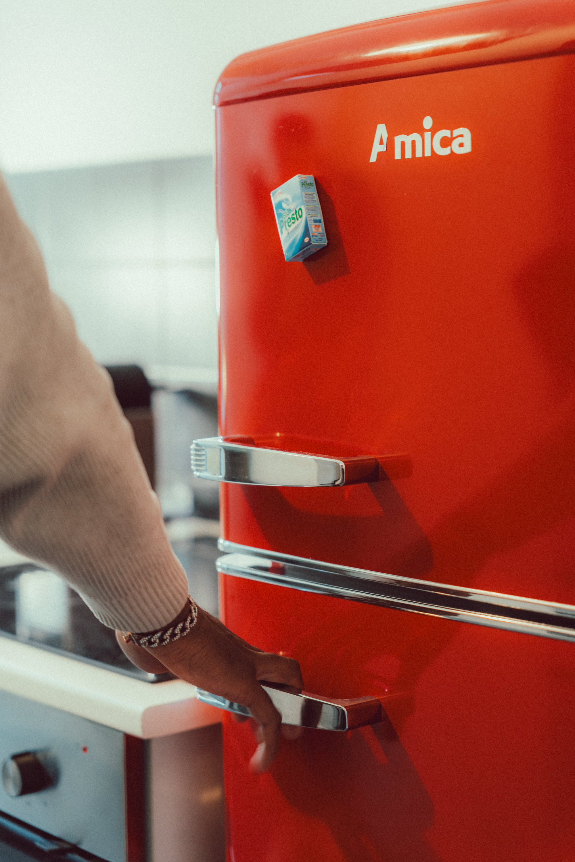 Red Retro Refrigerator with Hand Opening Door · Free Stock Photo
