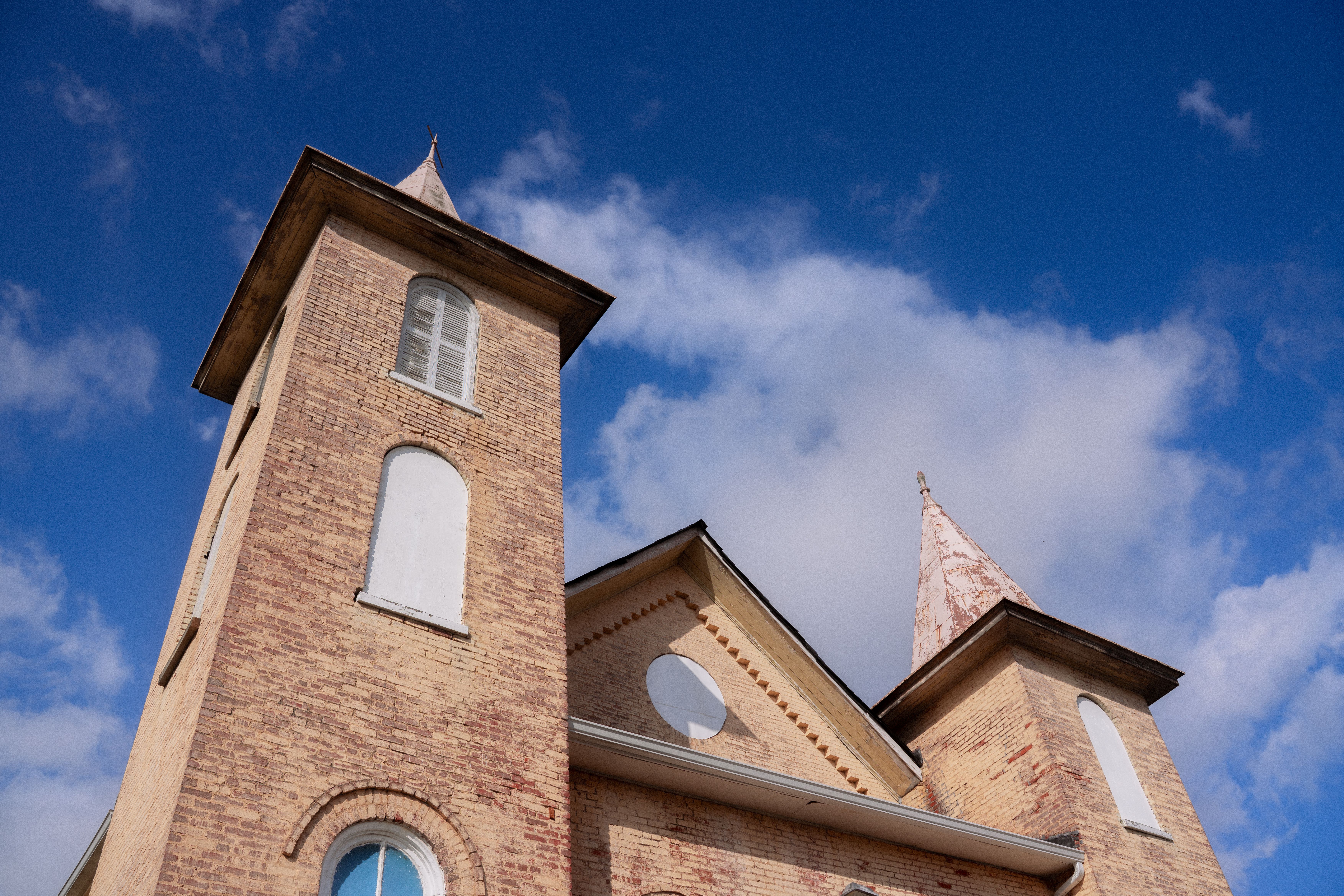 Historic Church Steeple Against Blue Sky · Free Stock Photo
