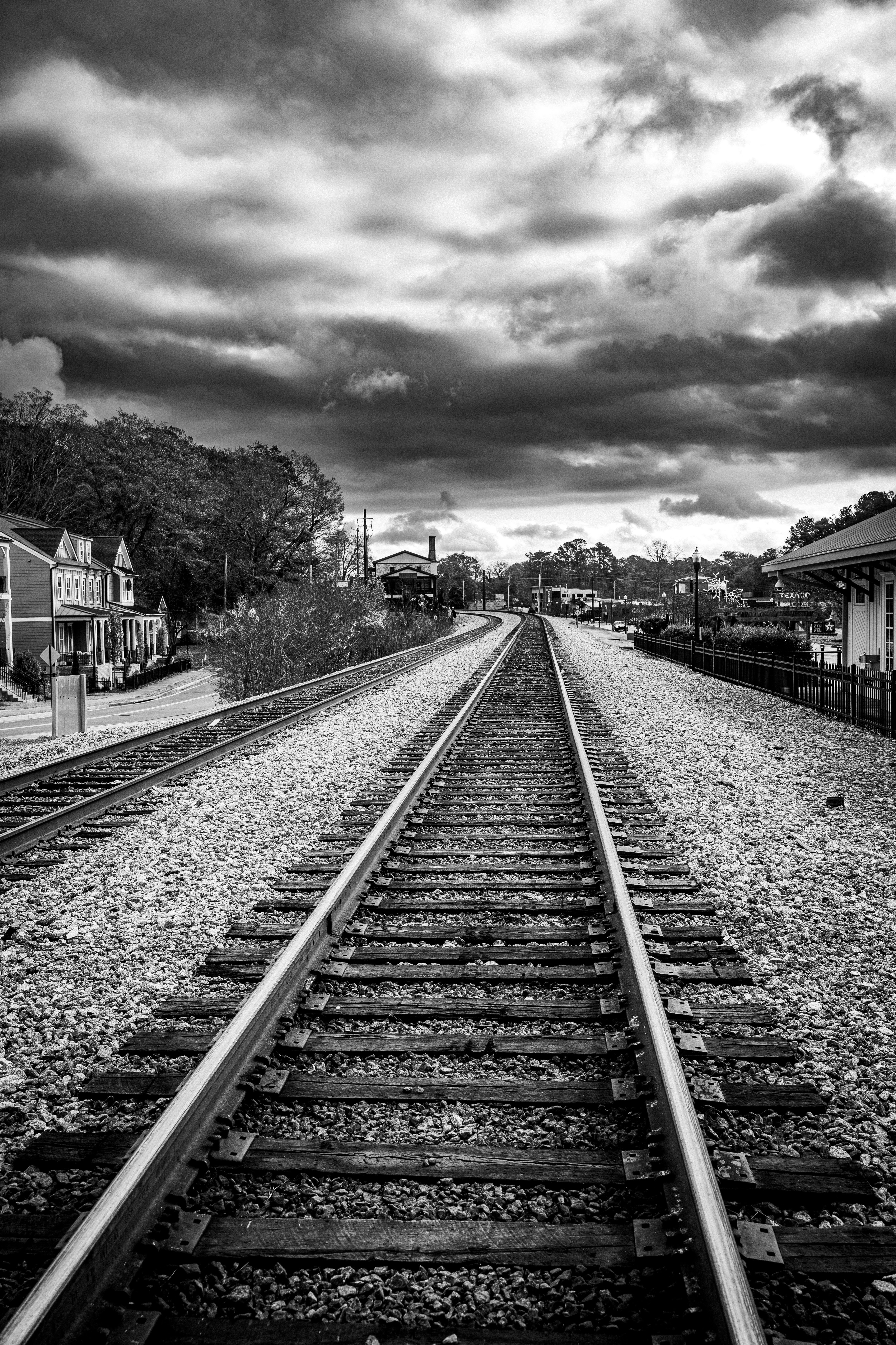 Grayscale Photo of Train Rail · Free Stock Photo