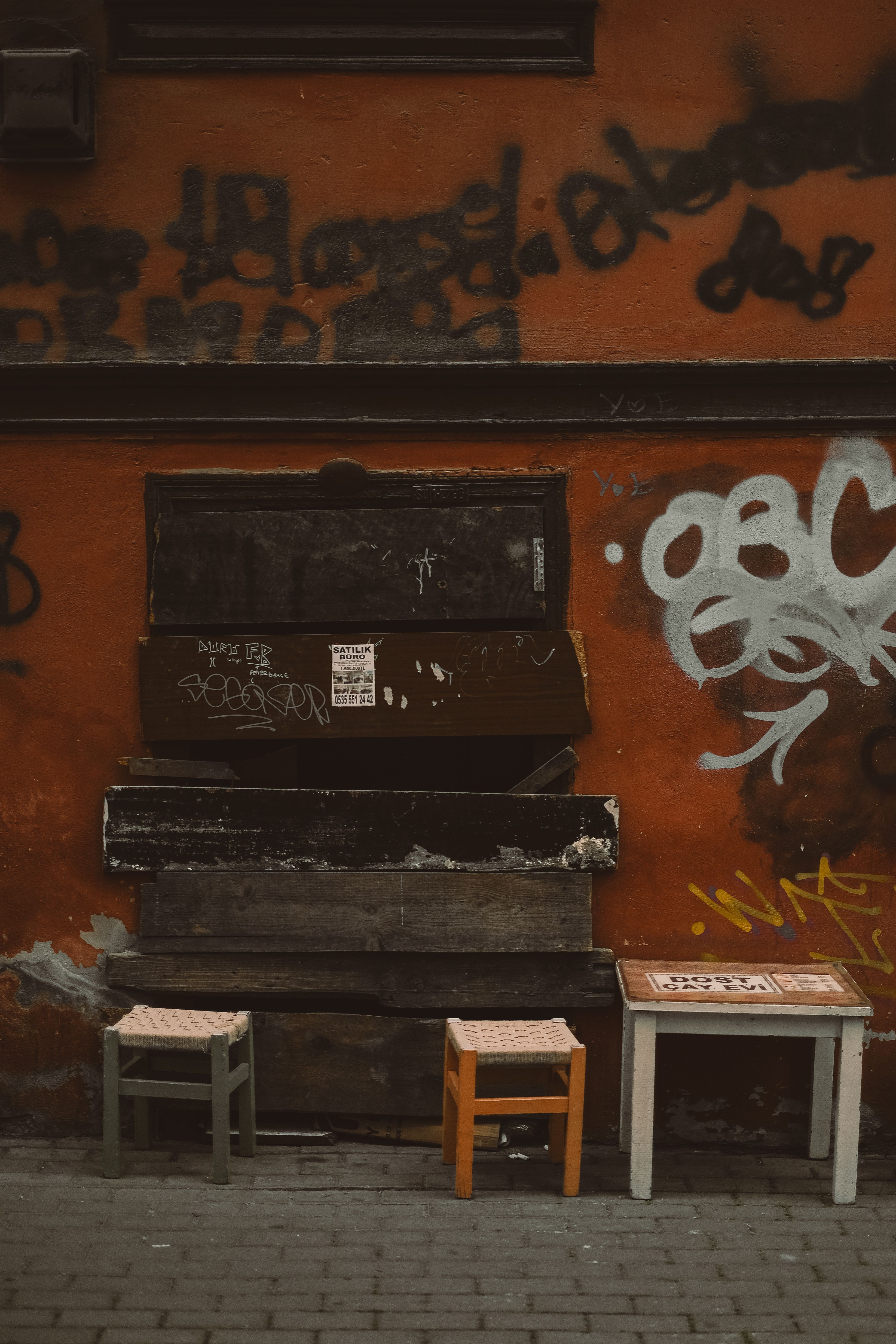 Urban Street Art with Graffiti and Stools · Free Stock Photo