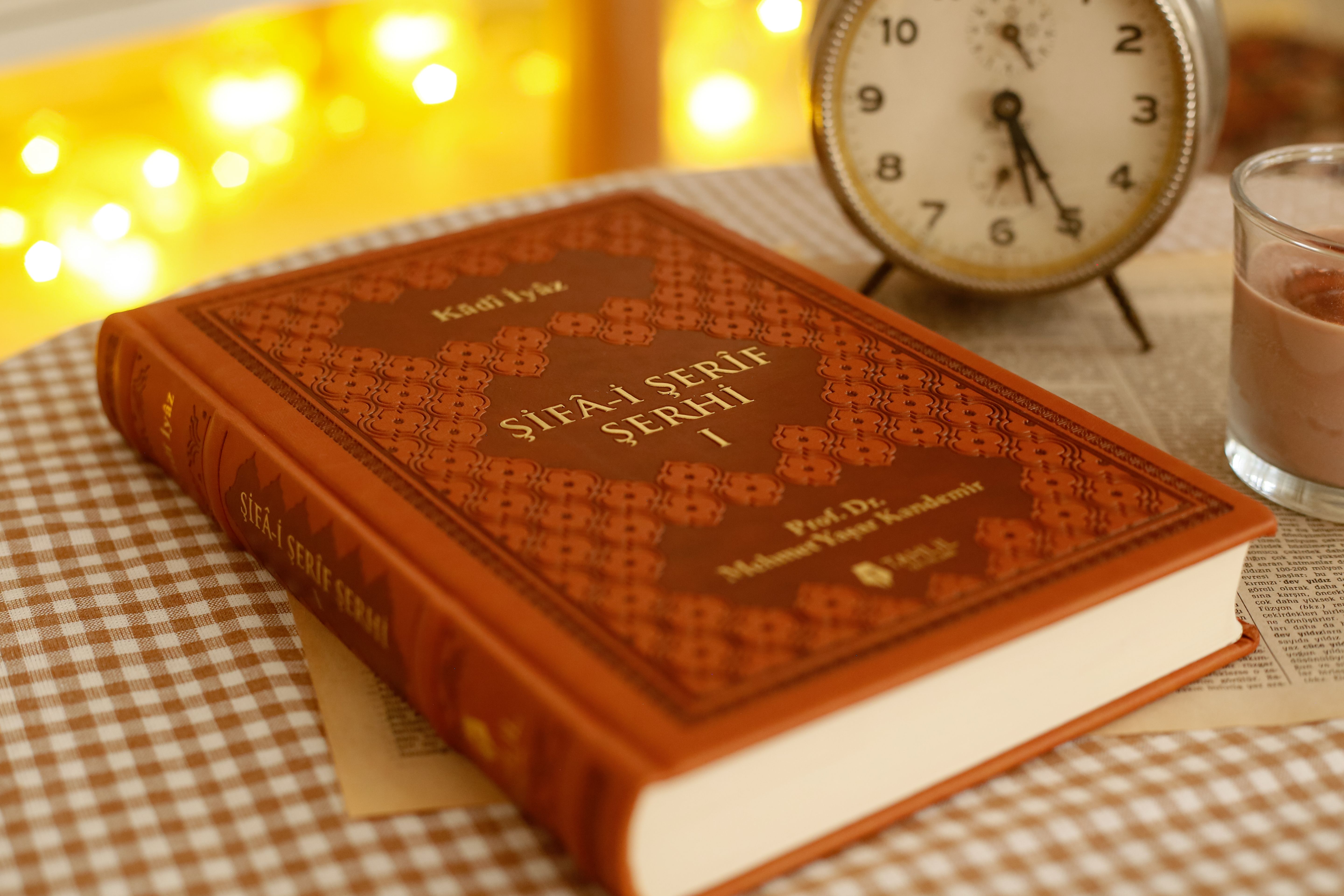 Vintage Book with Clock and Warm Lighting · Free Stock Photo