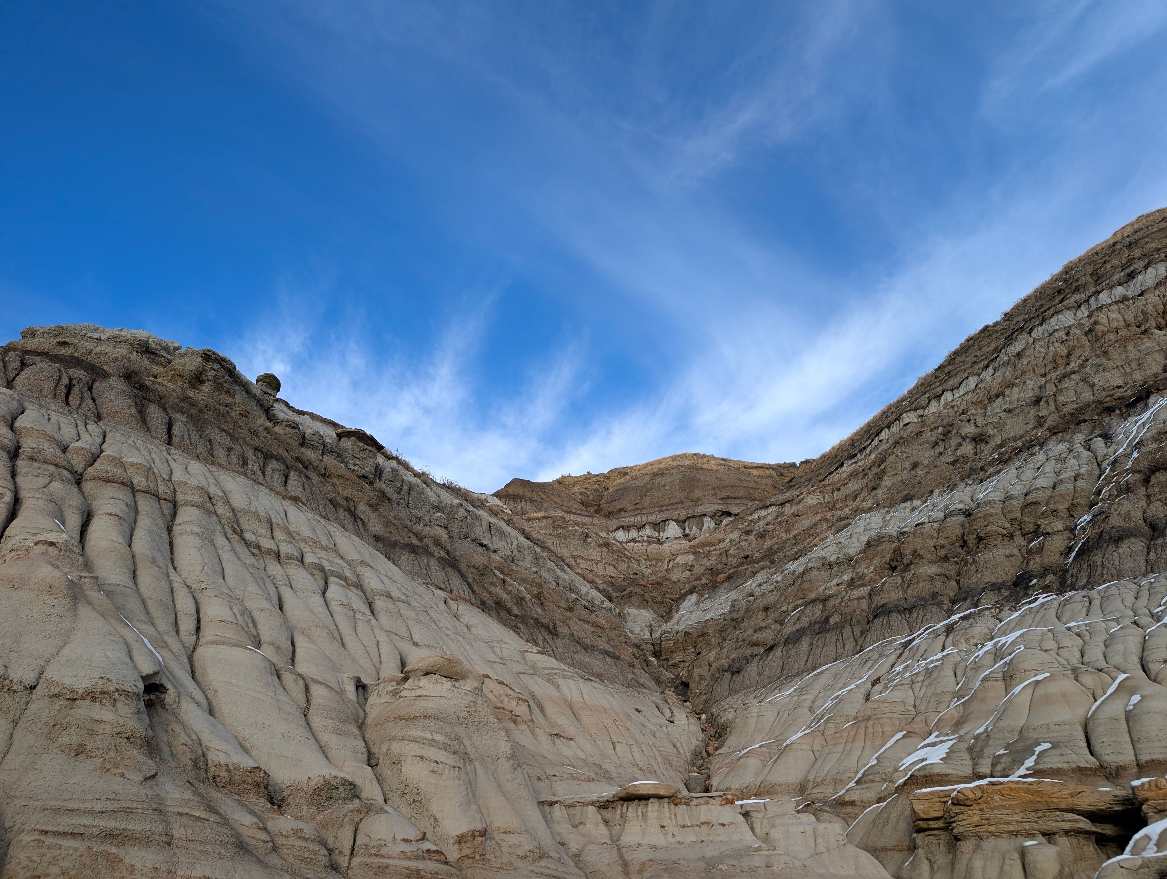 Stunning Badlands Rock Formations Under Blue Sky · Free Stock Photo