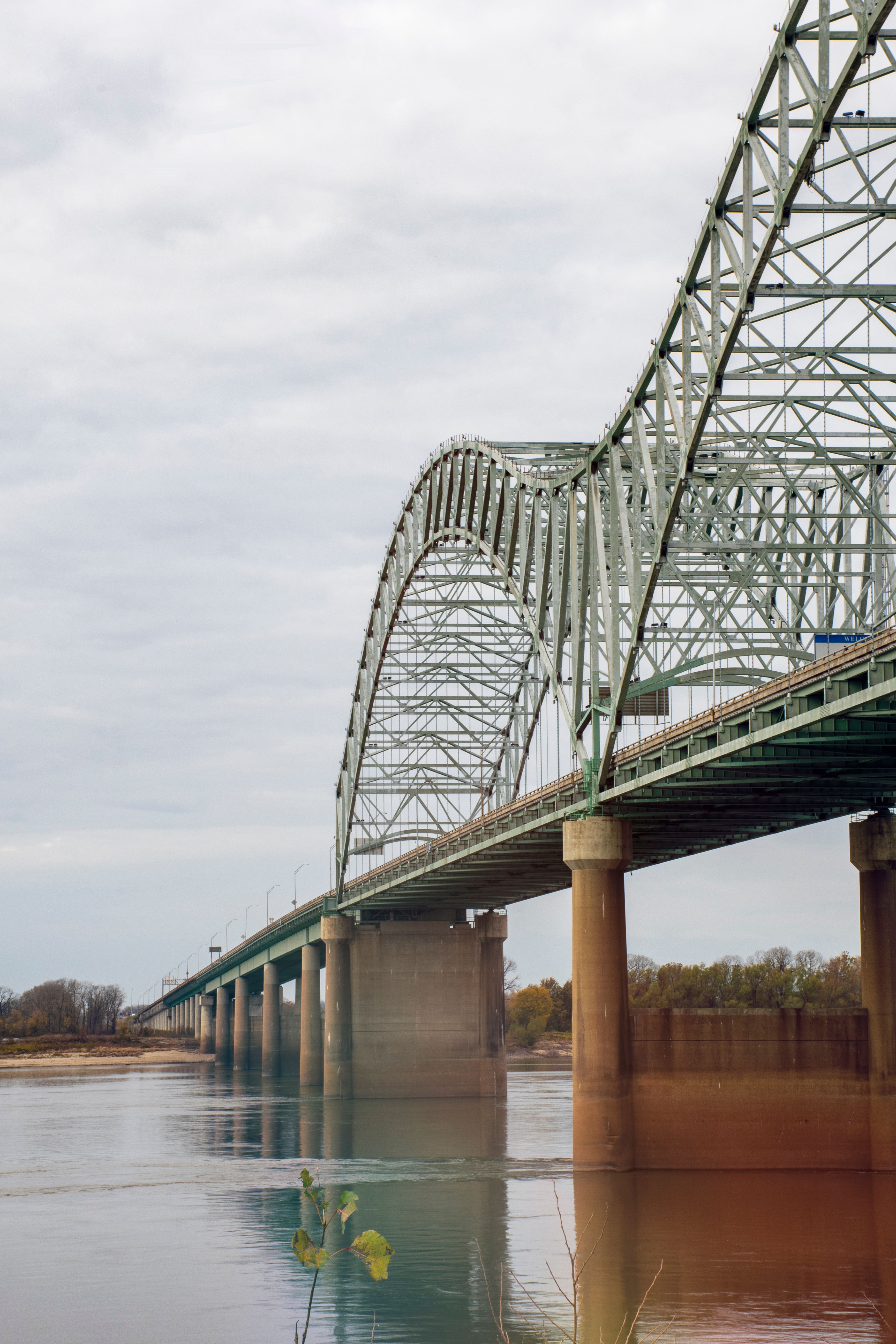 Iconic Steel Arch Bridge over River · Free Stock Photo