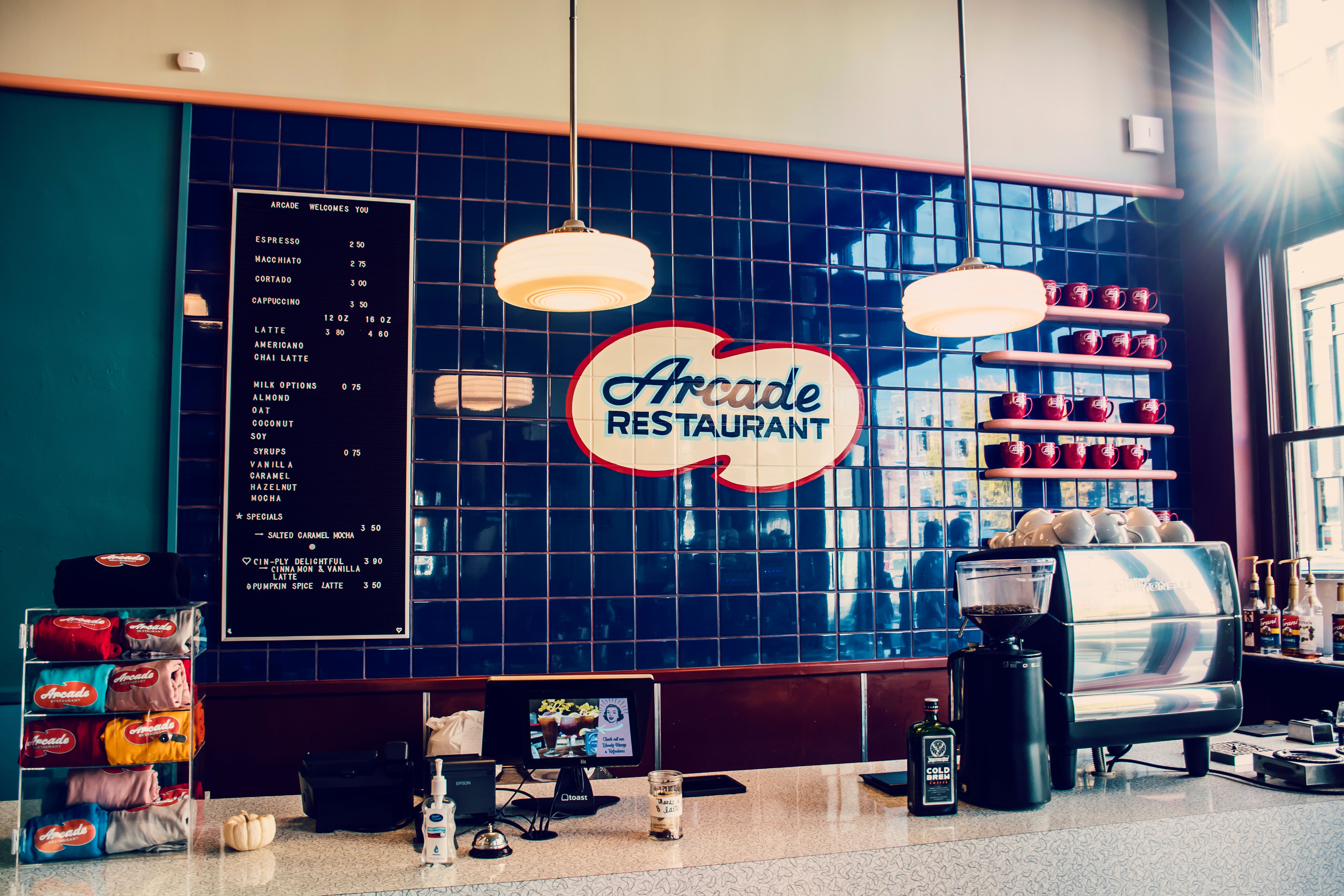 Arcade Restaurant Interior with Menu Board and Coffee Machine · Free ...