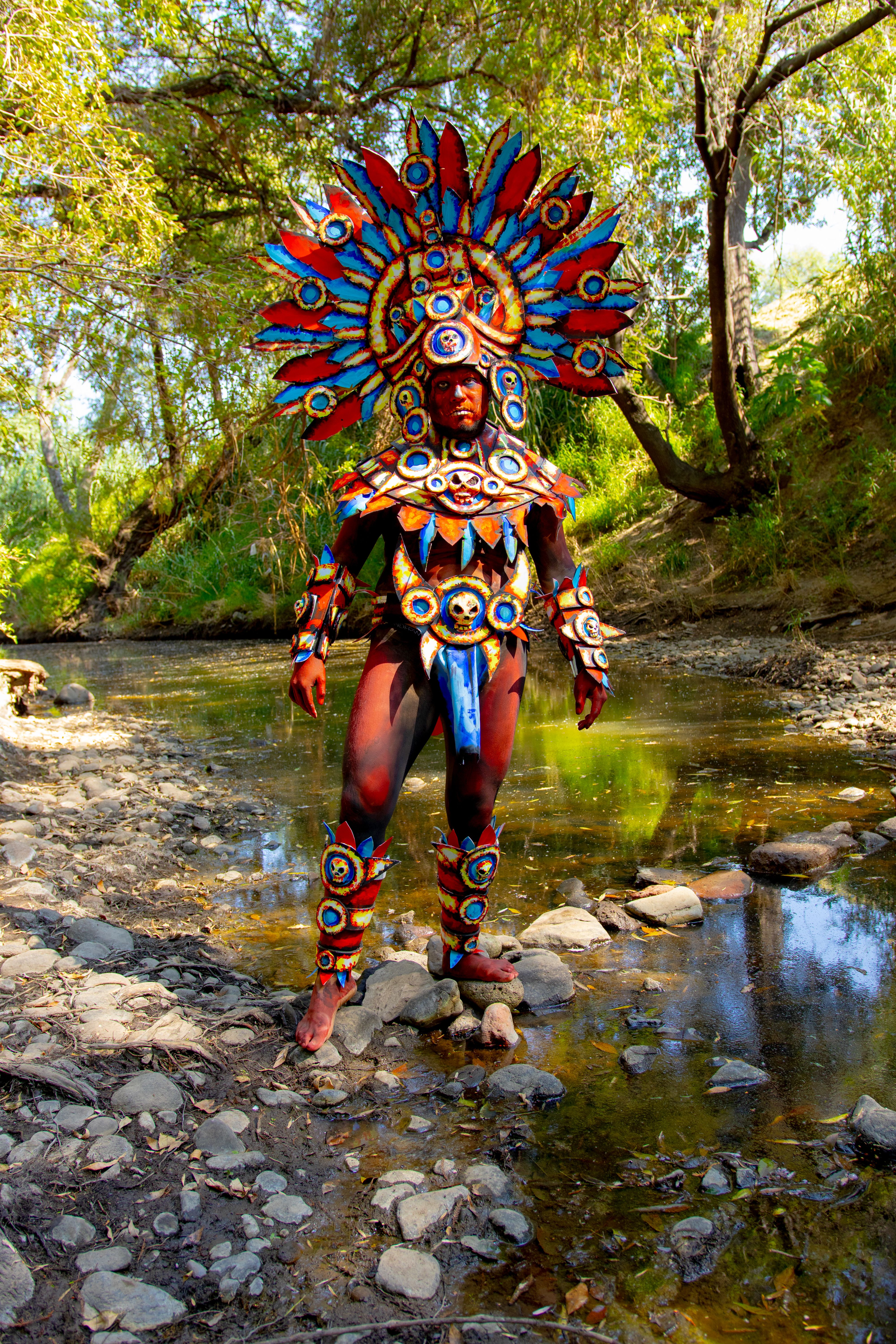 Vibrant Tribal Costume in Natural Setting · Free Stock Photo