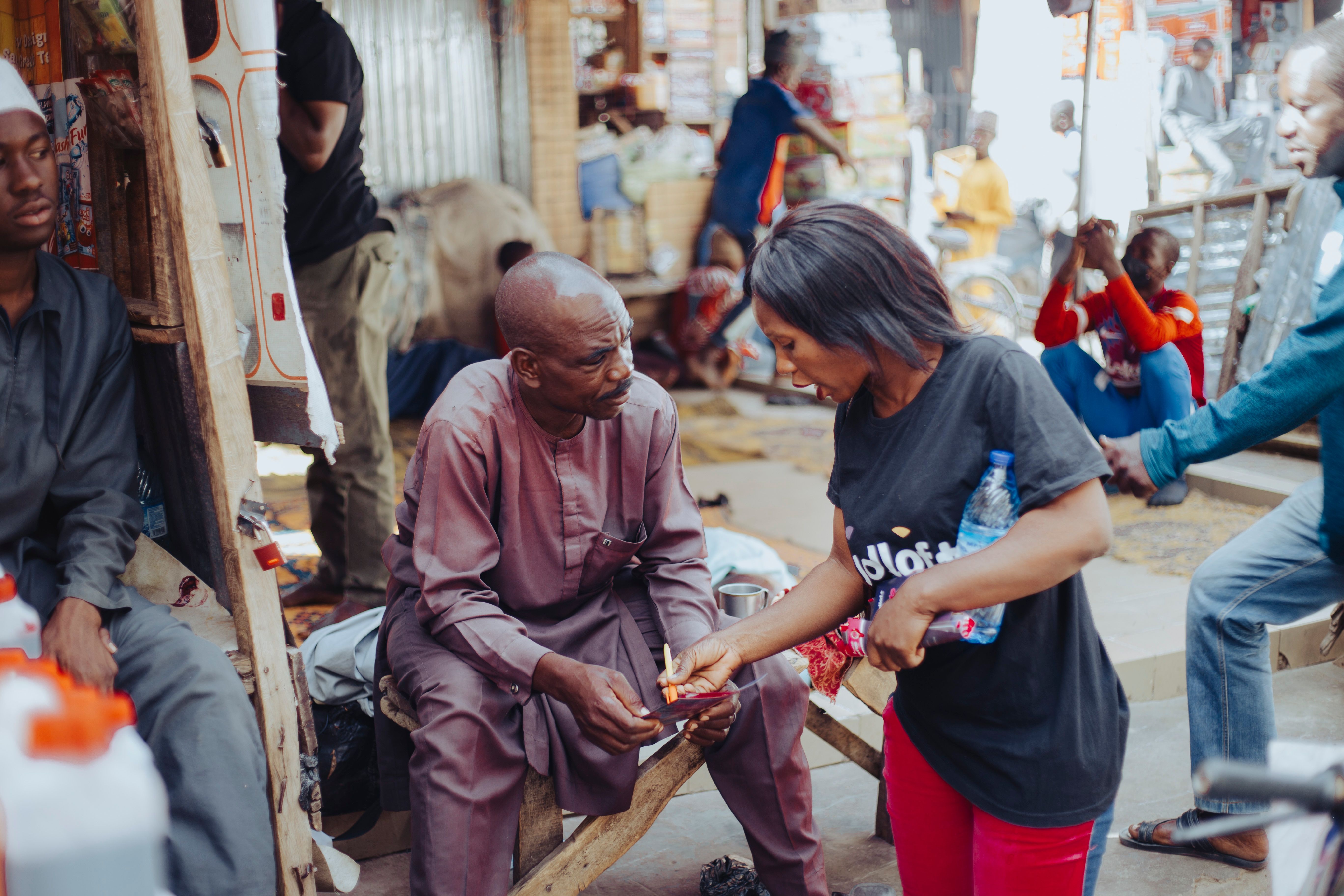 Street Market Interaction in a Bustling African City · Free Stock Photo