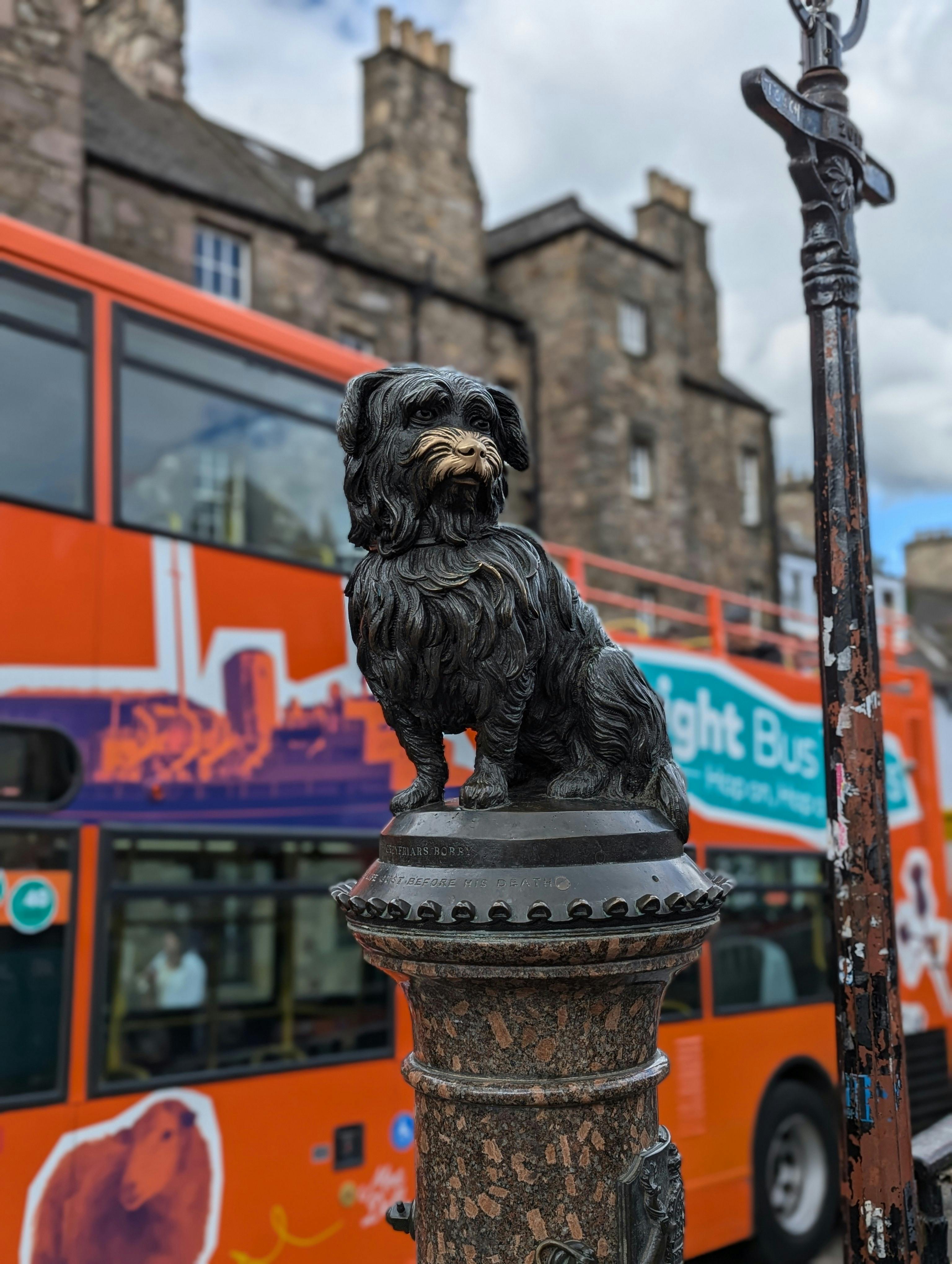 Famous Bobby Statue in Edinburgh with Tour Bus · Free Stock Photo