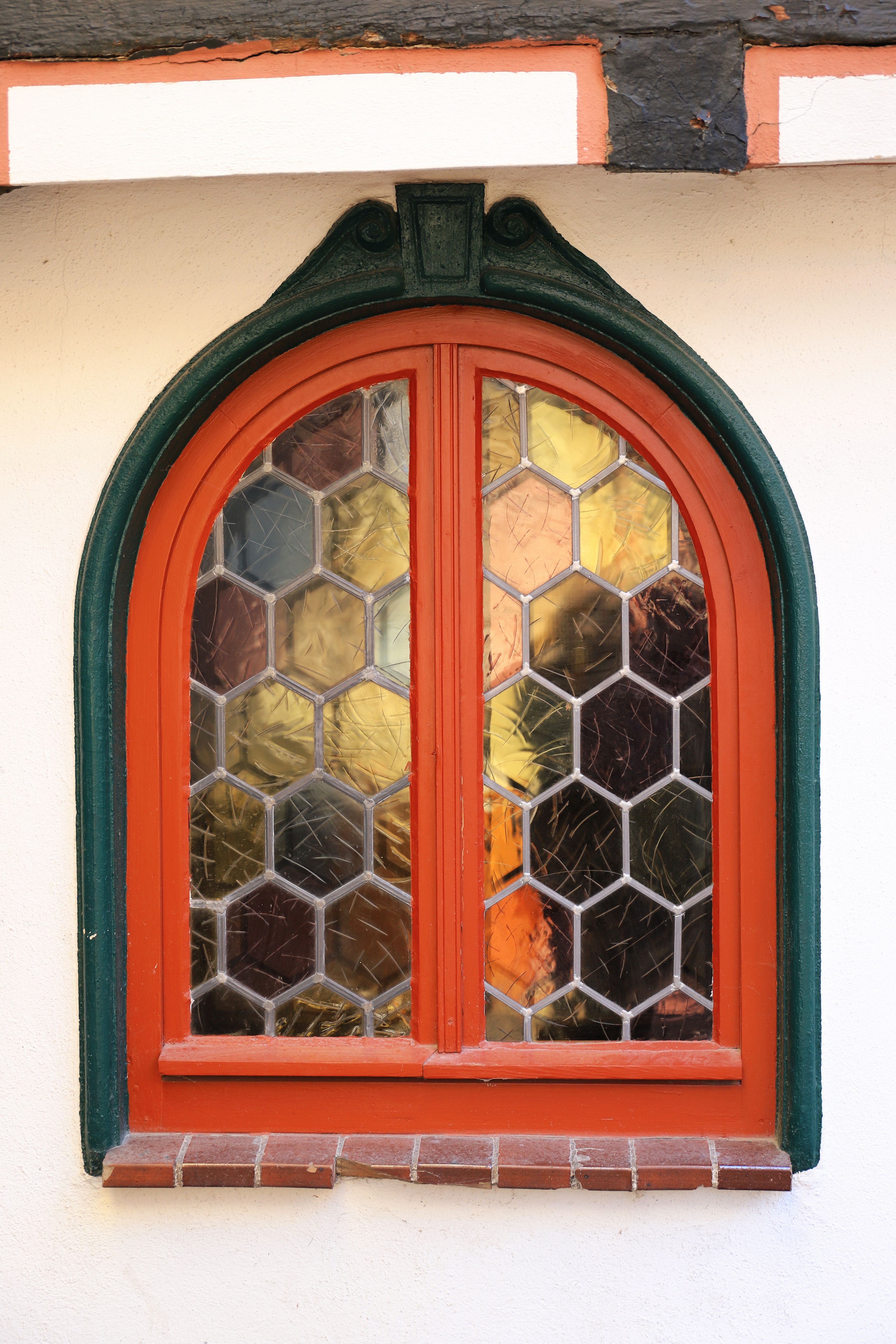 Historic Arched Window with Vibrant Trim · Free Stock Photo