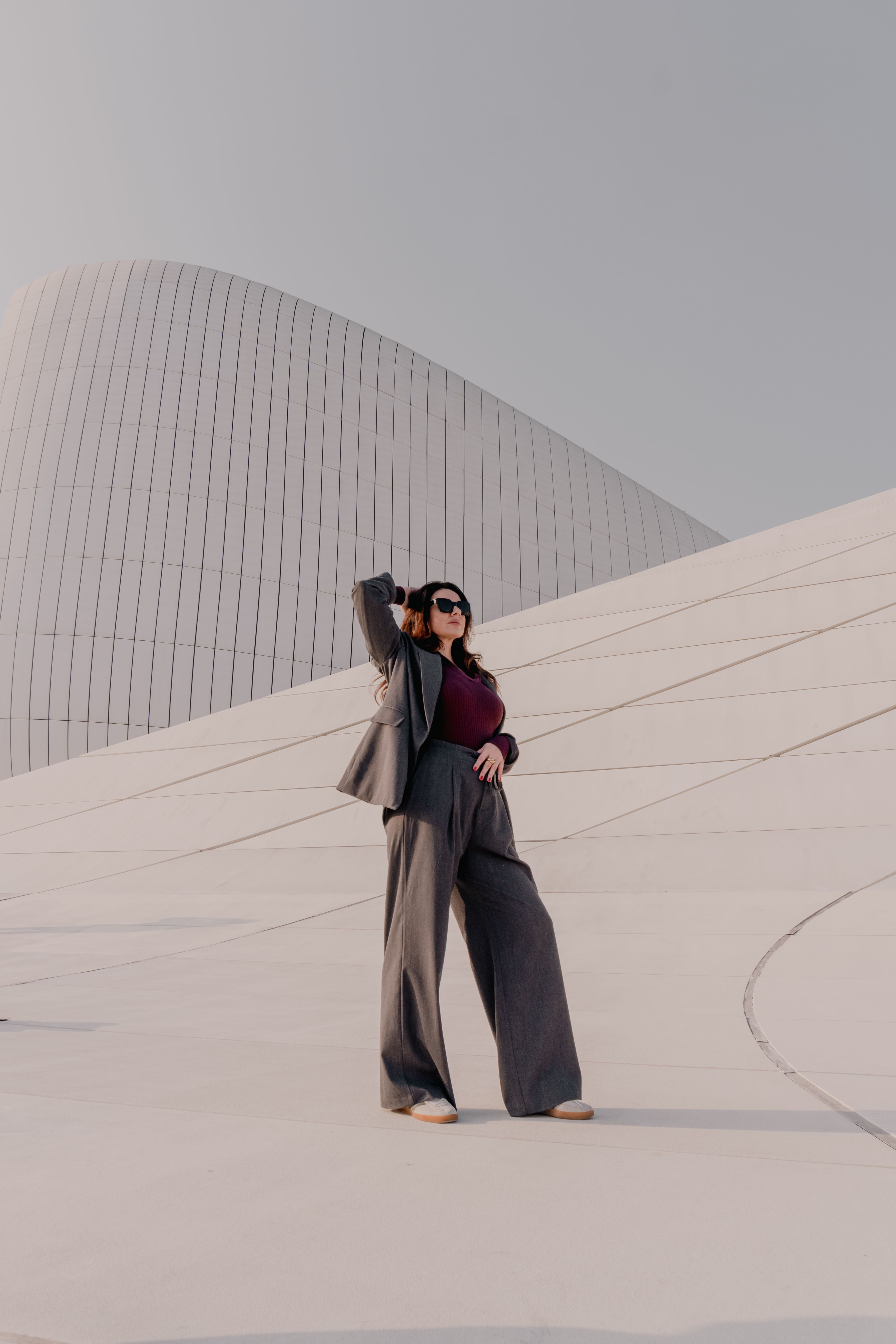 Stylish Woman Posing by Modern Architectural Building · Free Stock Photo
